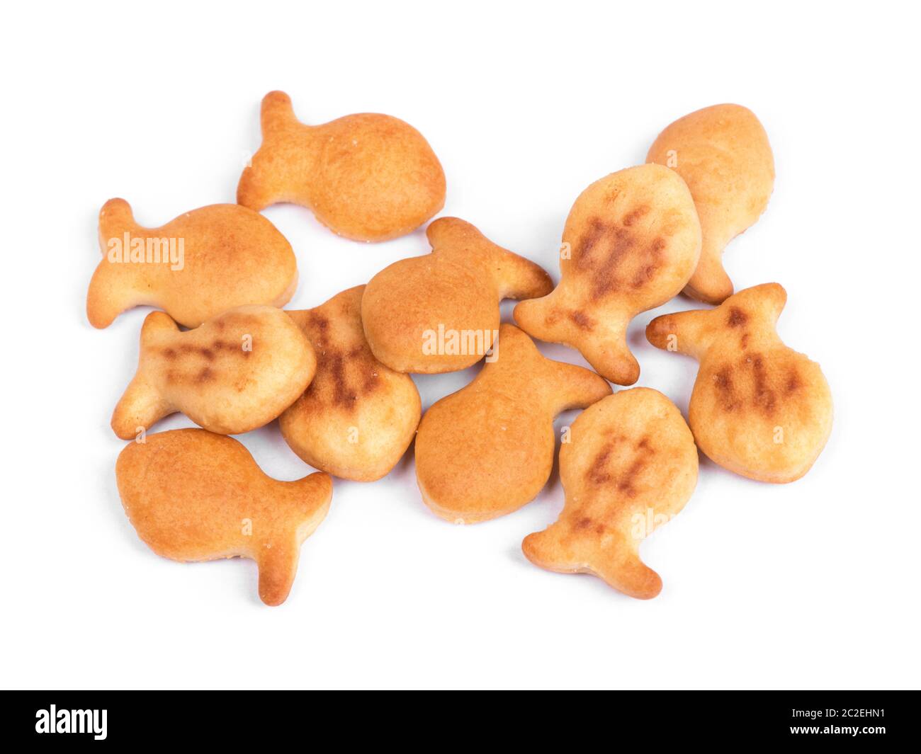Pile of fish-shaped cookies, salt crackers isolated on white background ...