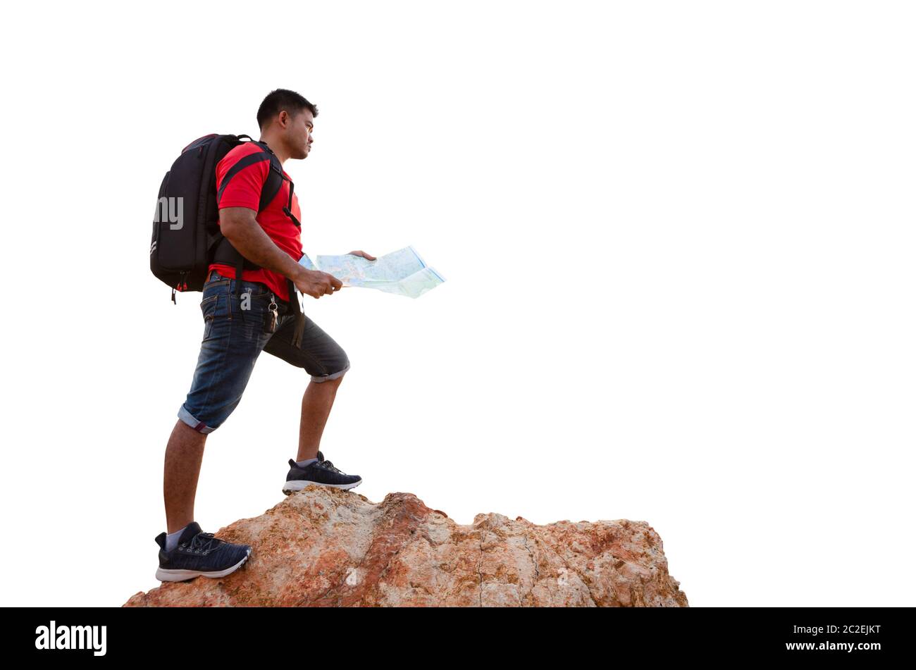 Adventurer man standing on rocky mountain with backpack and map ...