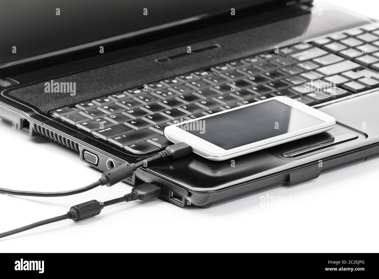 Data transfer between devices. Close up shot of mobile phone connected ...