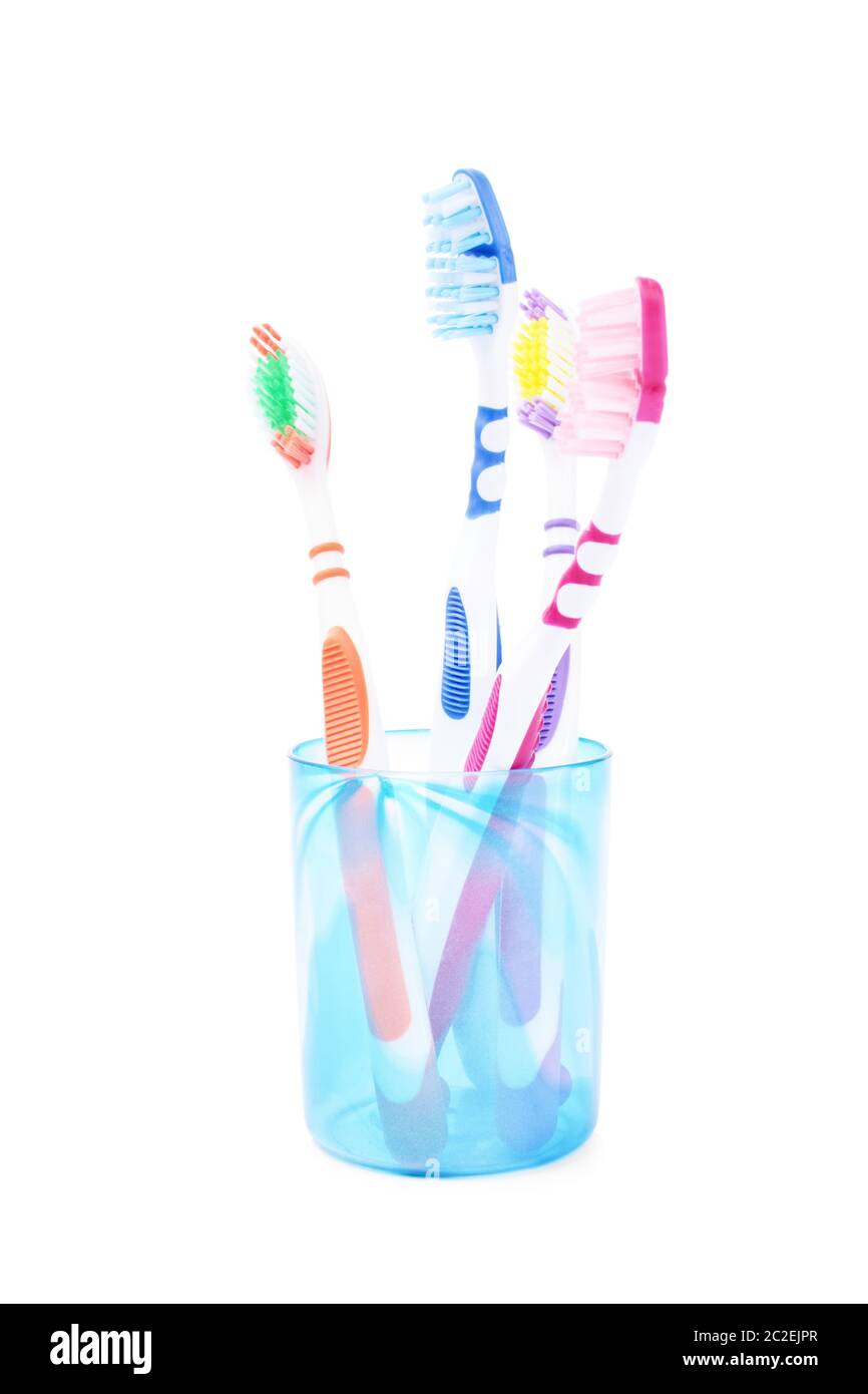 Set of family toothbrushes in a cup, isolated on white background Stock ...