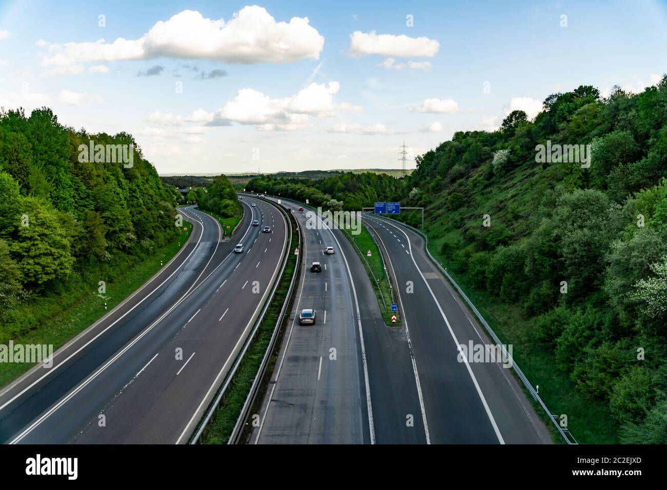 Highway in Germany with cars and sky with big clouds Stock Photo - Alamy