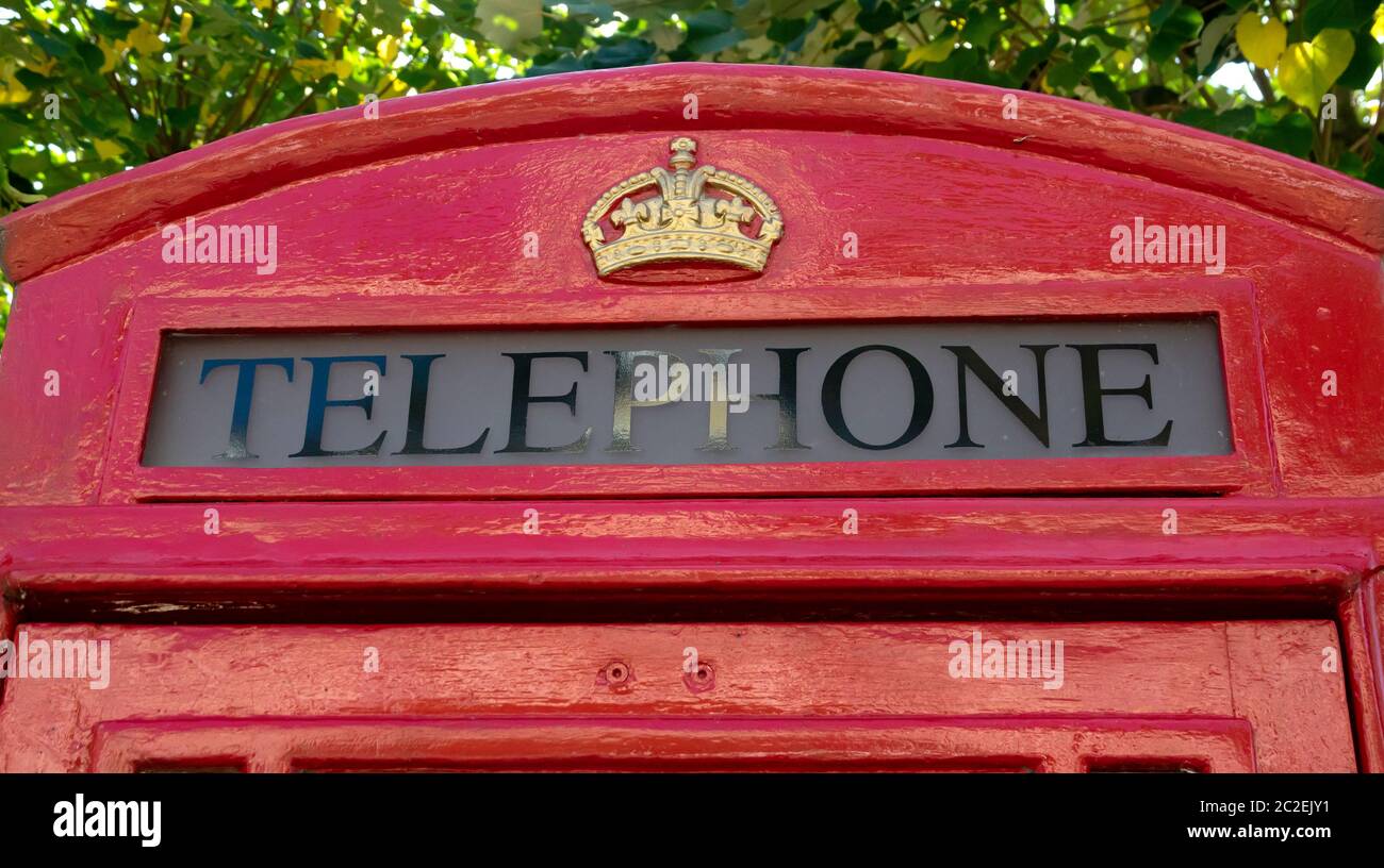 Detail from traditional red telephone box with golden crown Stock Photo ...