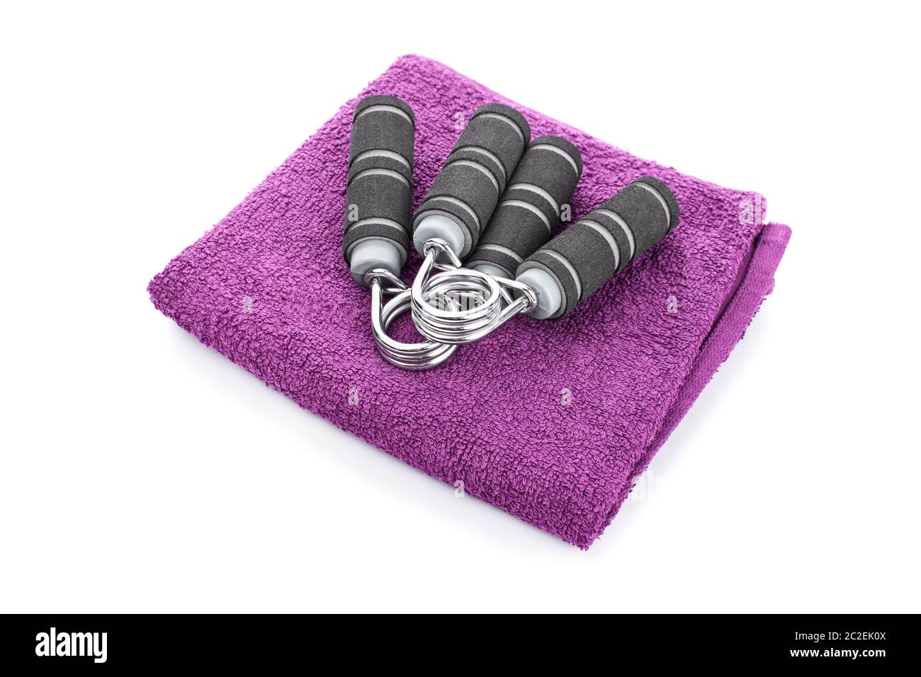Hand grips on a purple towel, isolated on white background Stock Photo ...
