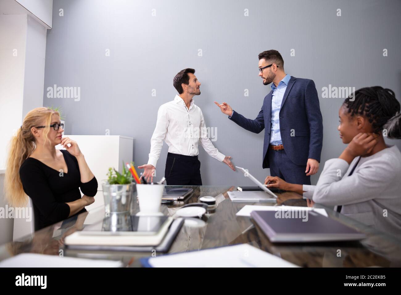 Dissatisfied CEO Shouting At His Young Male Worker For Bad Performance ...