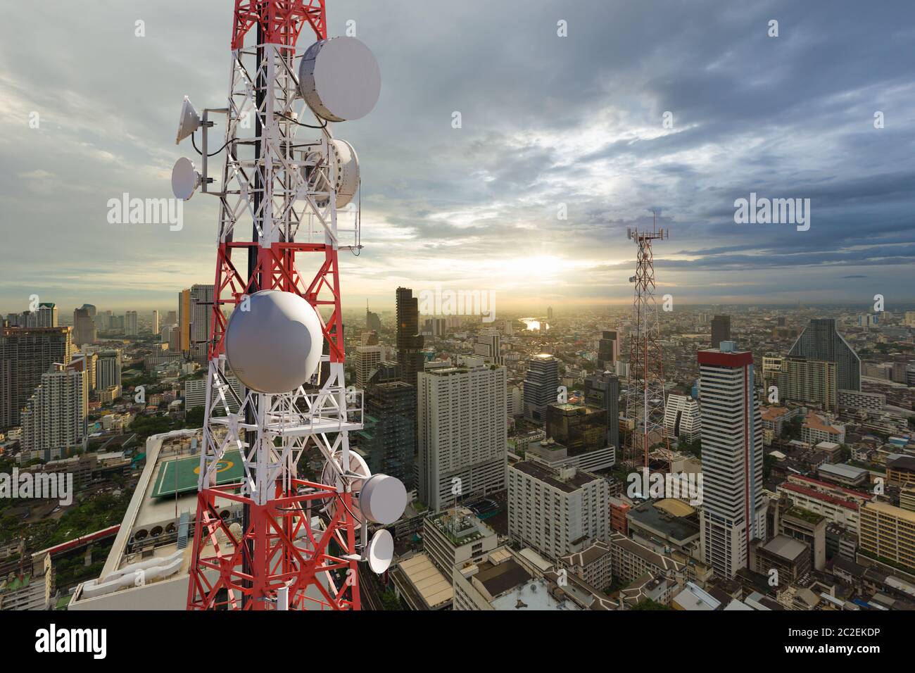 Telecommunication tower with 5G cellular network antenna on city background Stock Photo - Alamy
