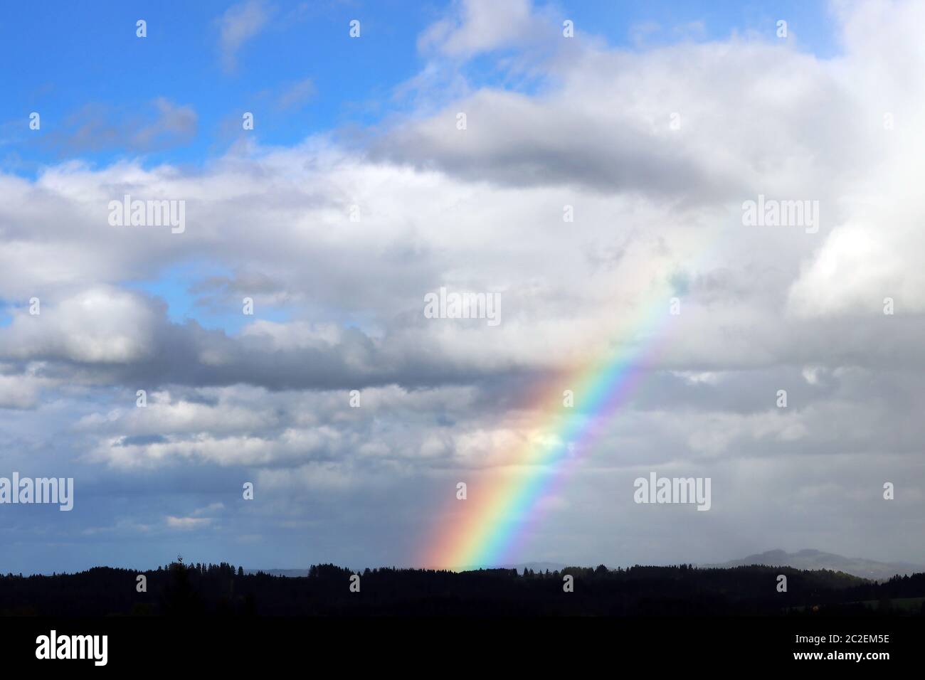 Rainbow in a rainy sky hi-res stock photography and images - Alamy