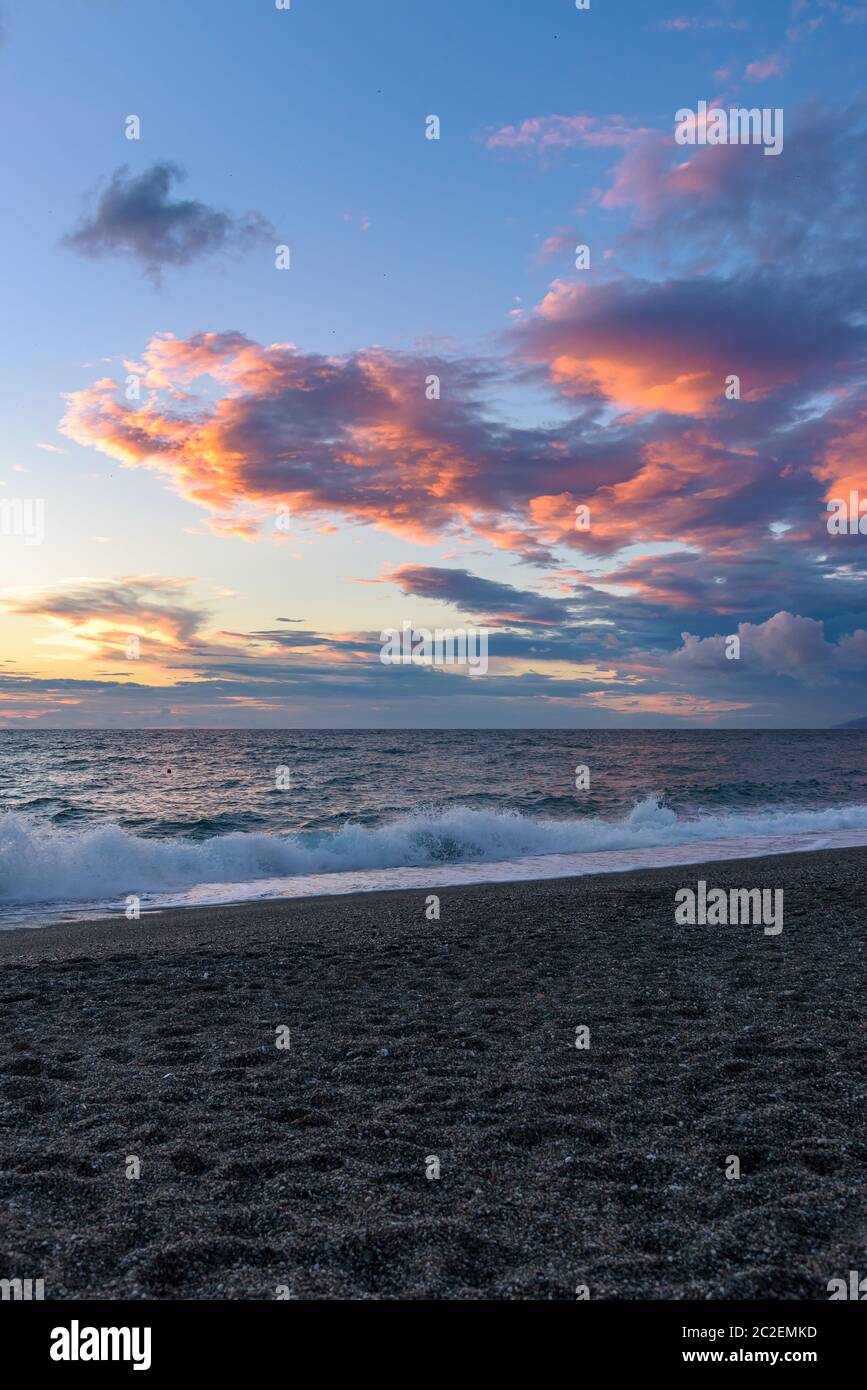 Picturesque sunset on the Calabrian beach in Italy Stock Photo - Alamy
