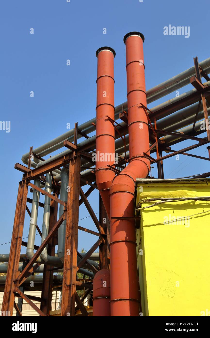 Outdoor industrial pipes of manufacturing plant on a sunny day Stock ...