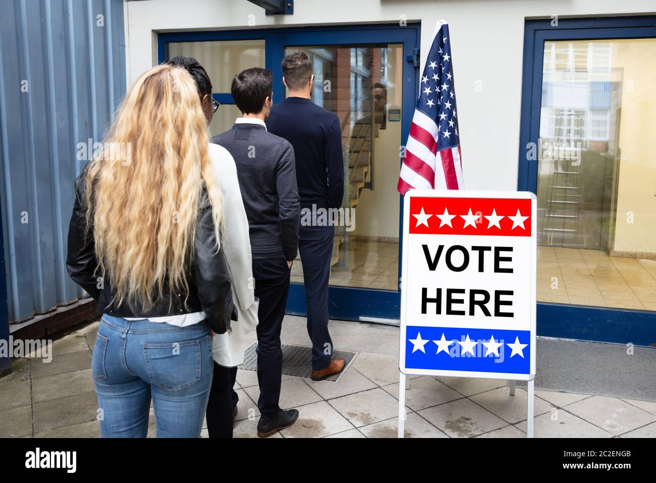 Group Of Young People Standing At The Entrance Of Voting Room Stock ...