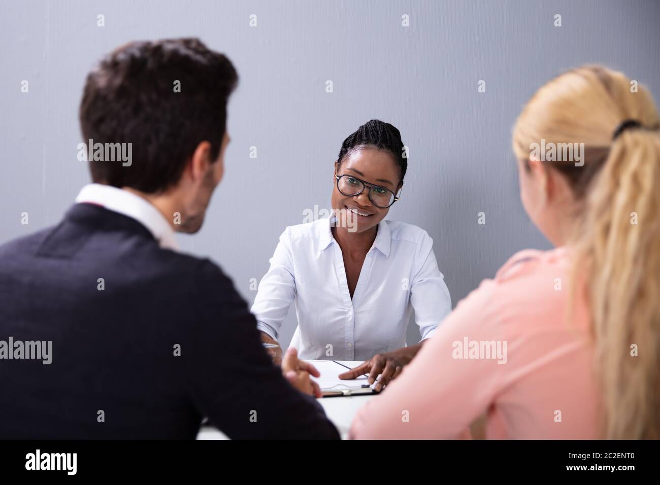 Couple Sitting And Talking At Interview At Adoption Agency Stock Photo ...