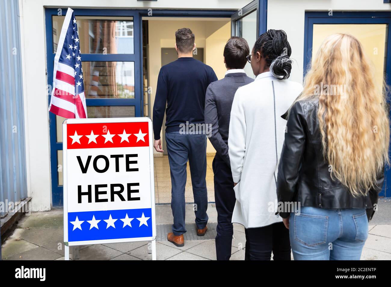 Group Of Young People Standing At The Entrance Of Voting Room Stock ...