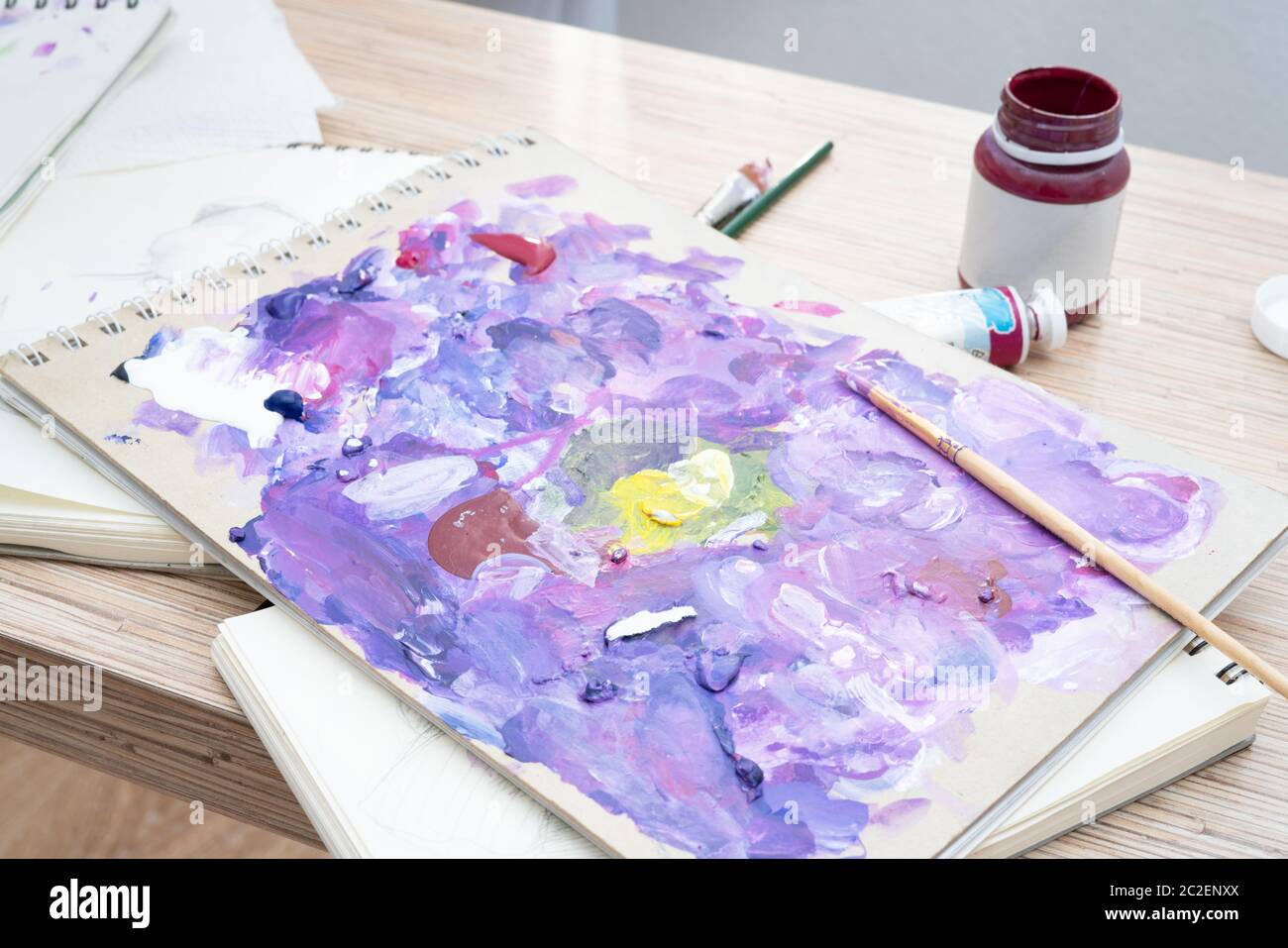 Tools of the artist. Palette, paints, brushes during use. Creativity ...
