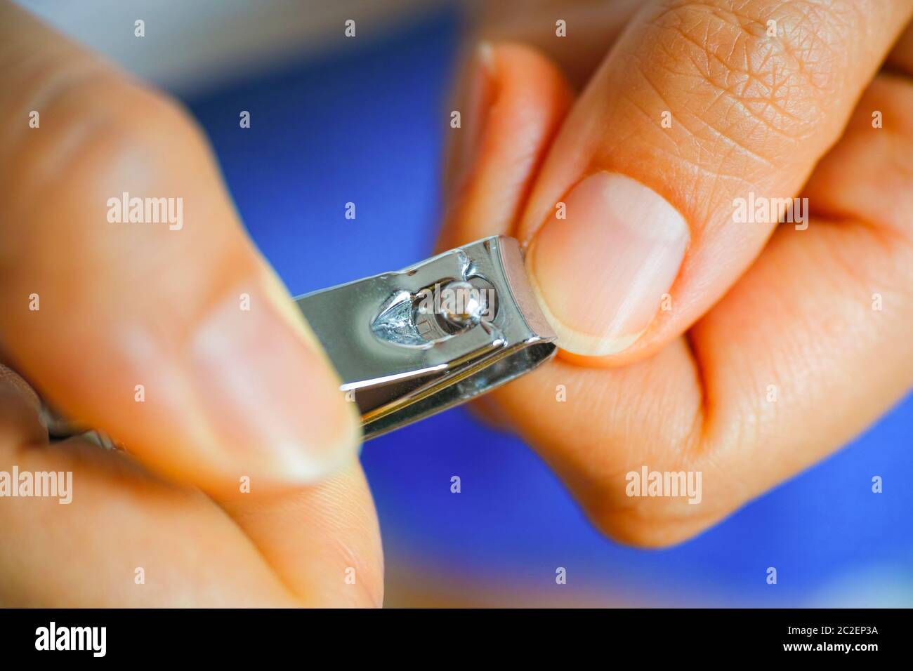 Woman with nail clipper cutting her fingernails. Close-up Stock Photo ...