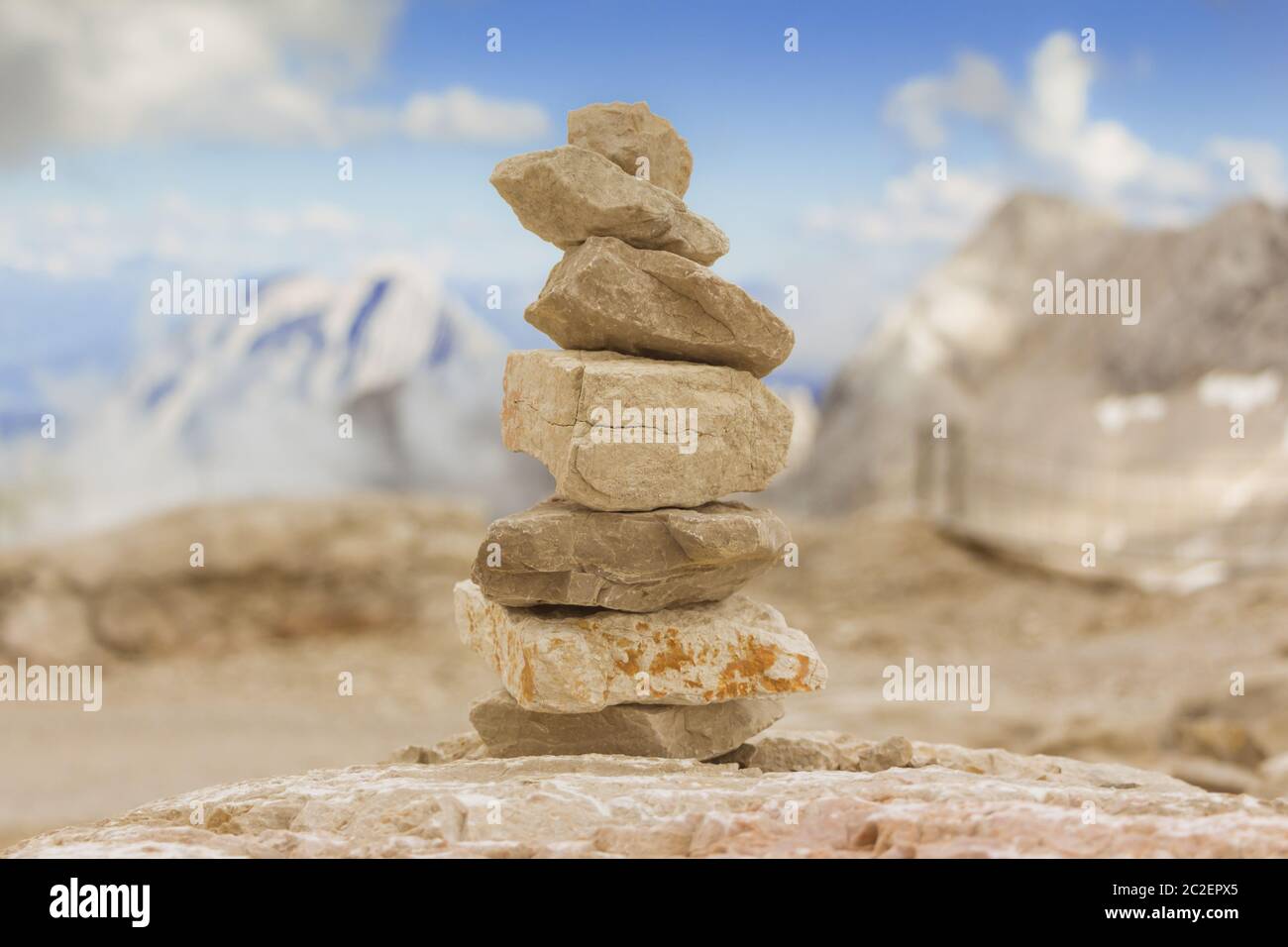 Stones stack in mountain panorama with blue sky visualizes creativity ...