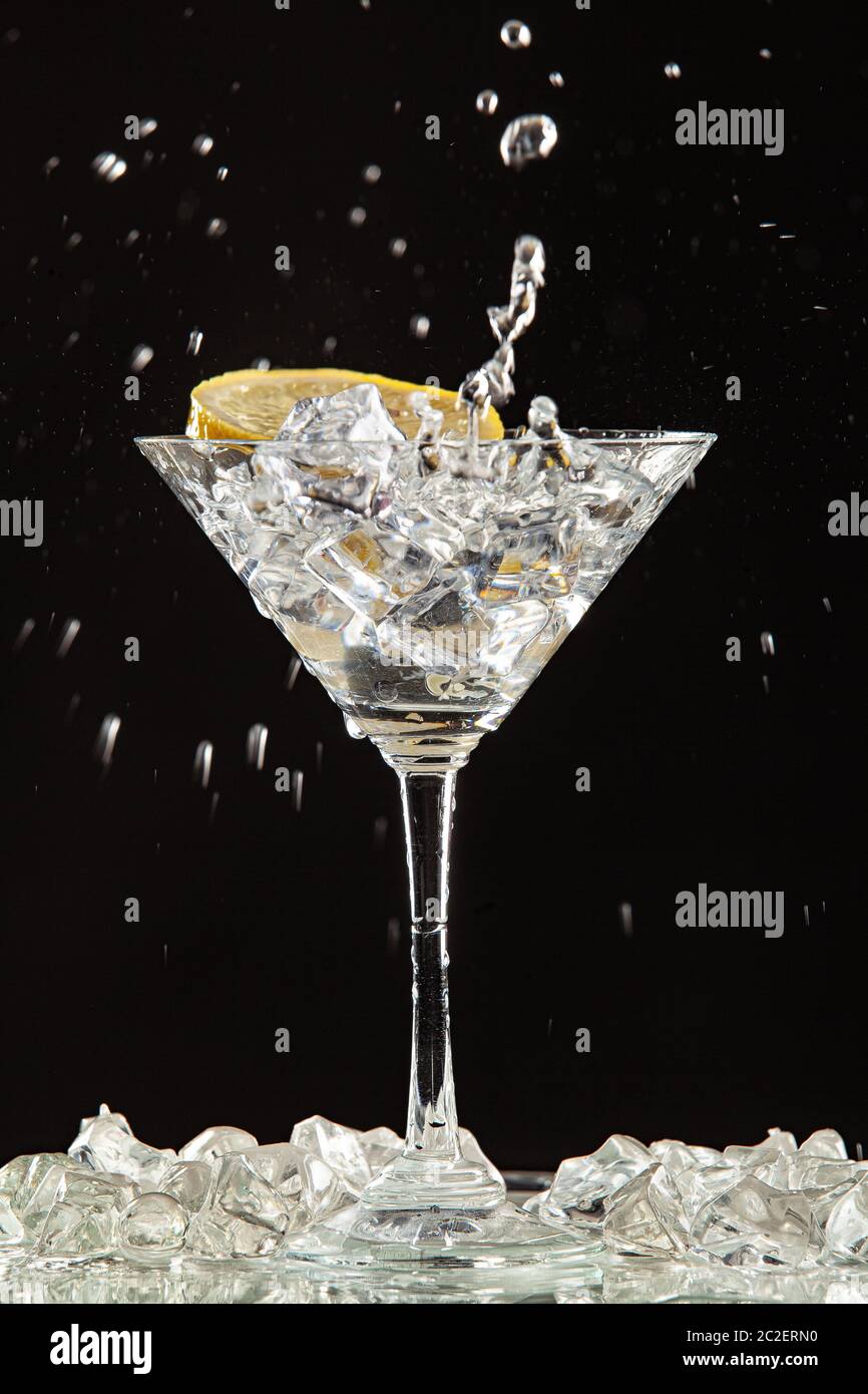 Glass, Lemon And Splash Of Water Stock Photo - Alamy