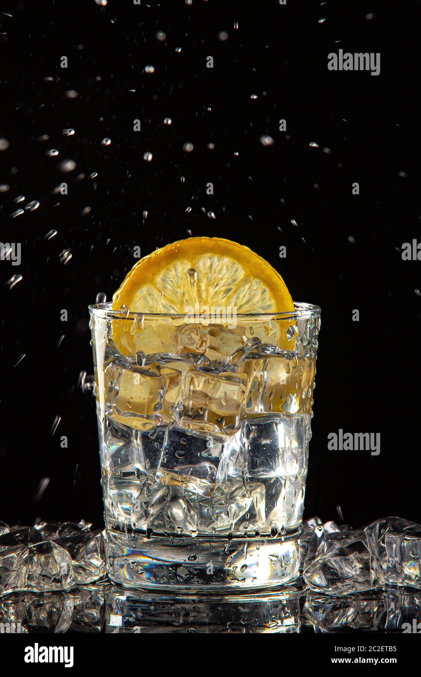 Glass Of Water, Ice And Lemon Stock Photo - Alamy