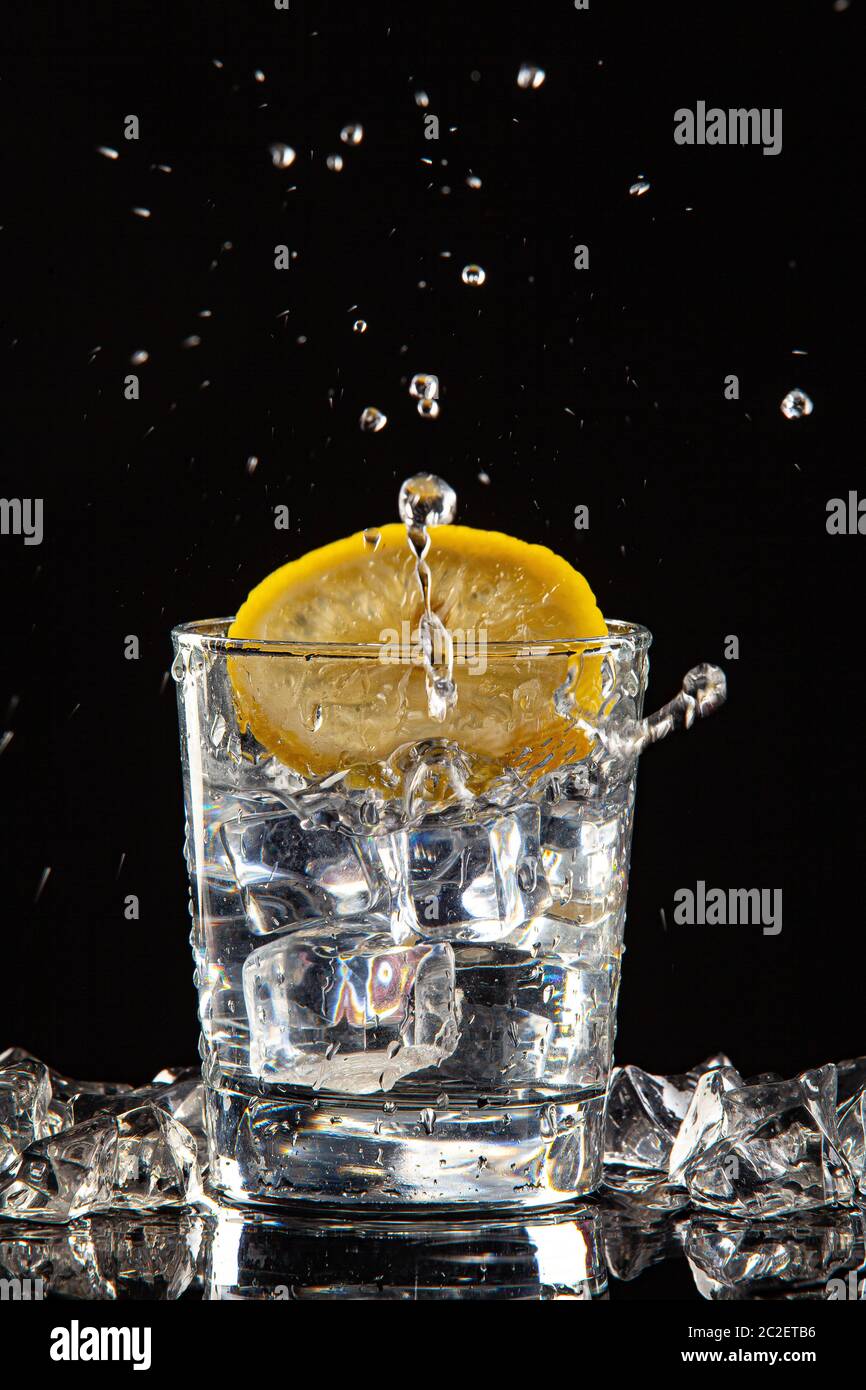 Glass Of Water, Ice And Lemon Stock Photo - Alamy