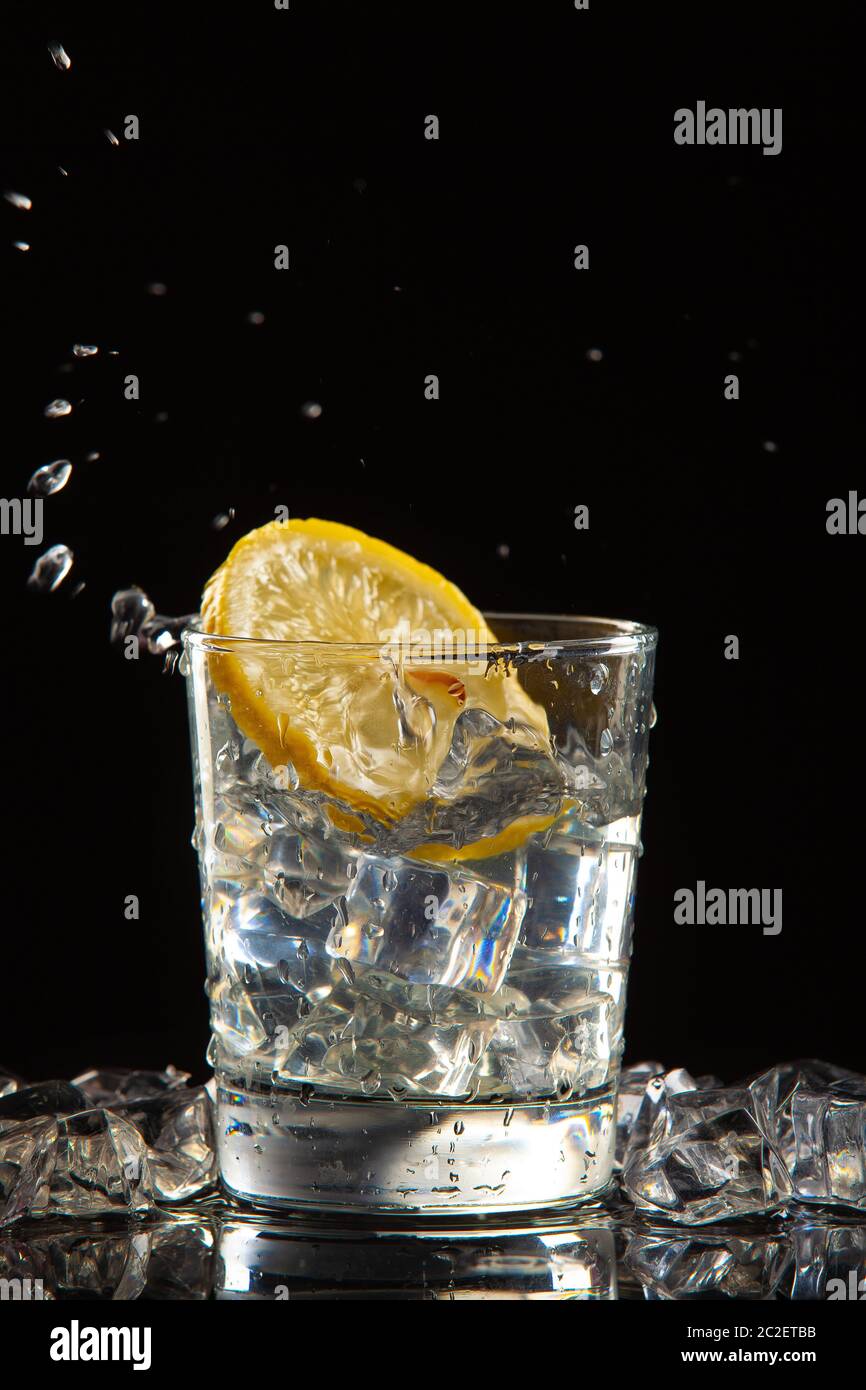 Glass Of Water, Ice And Lemon Stock Photo - Alamy