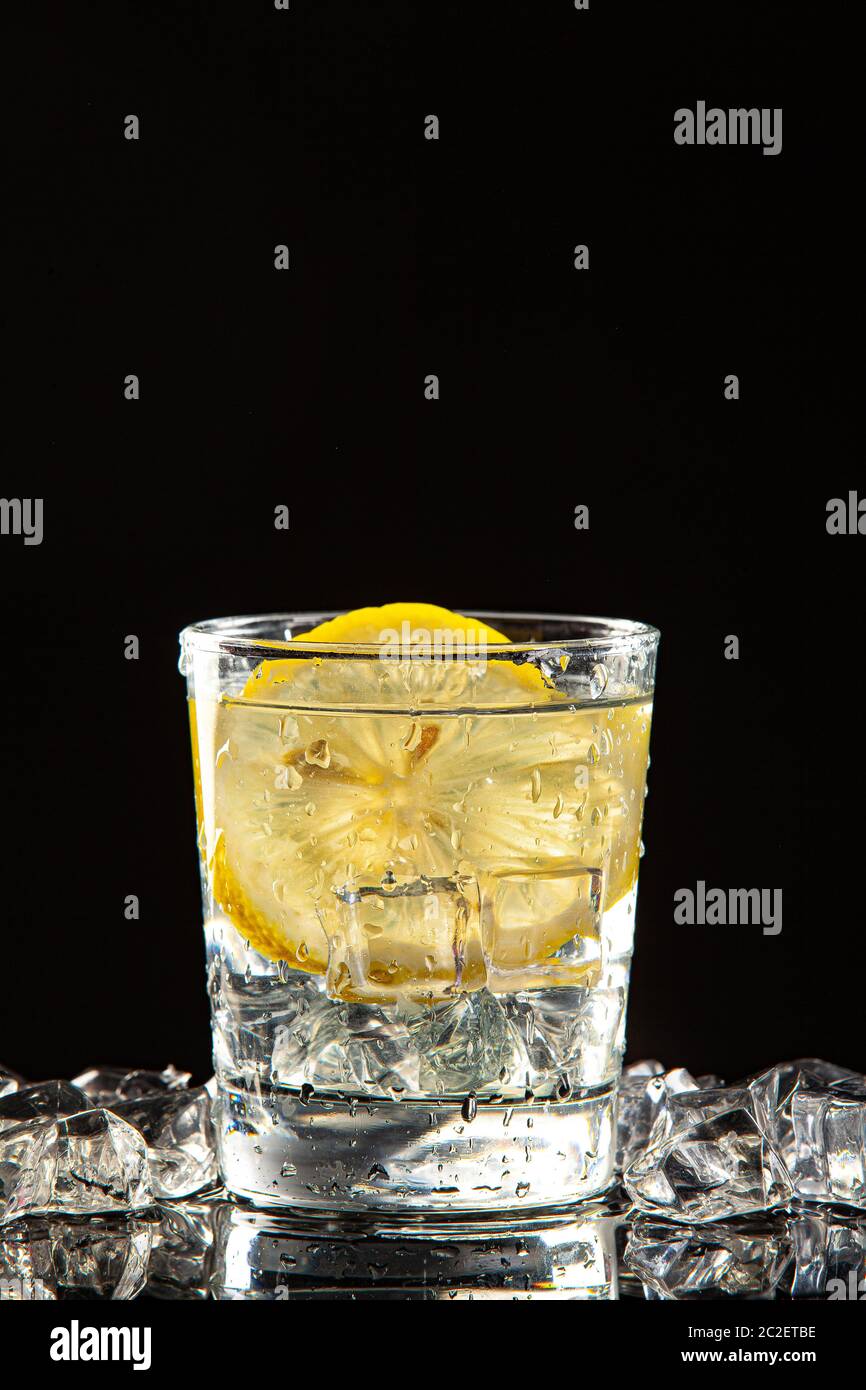 Glass Of Water, Ice And Lemon Stock Photo - Alamy