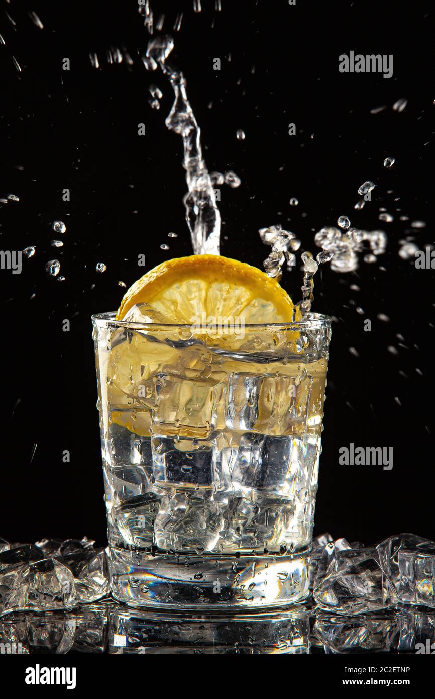 Glass Of Water, Ice And Lemon Stock Photo - Alamy