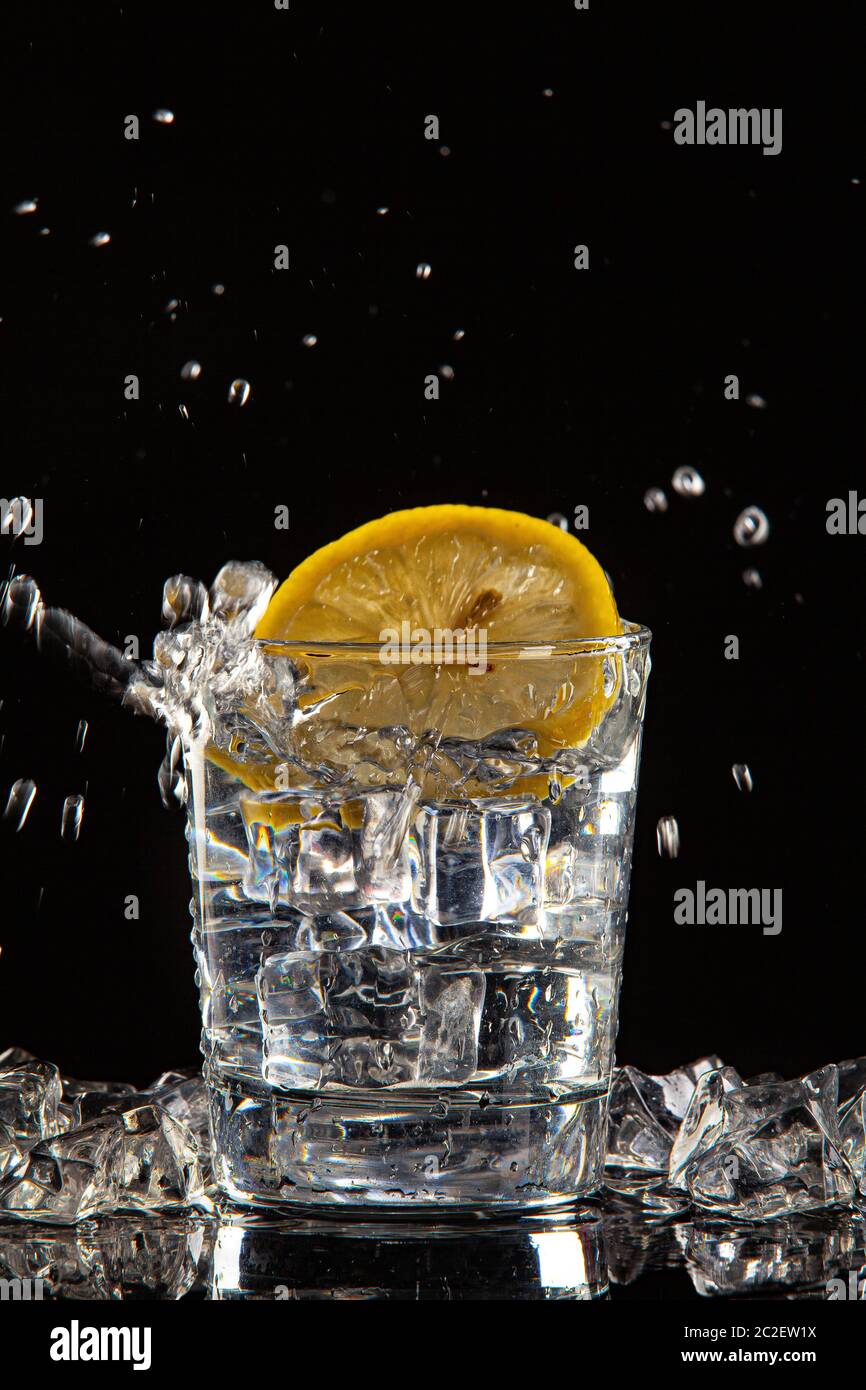 Glass Of Water, Ice And Lemon Stock Photo - Alamy