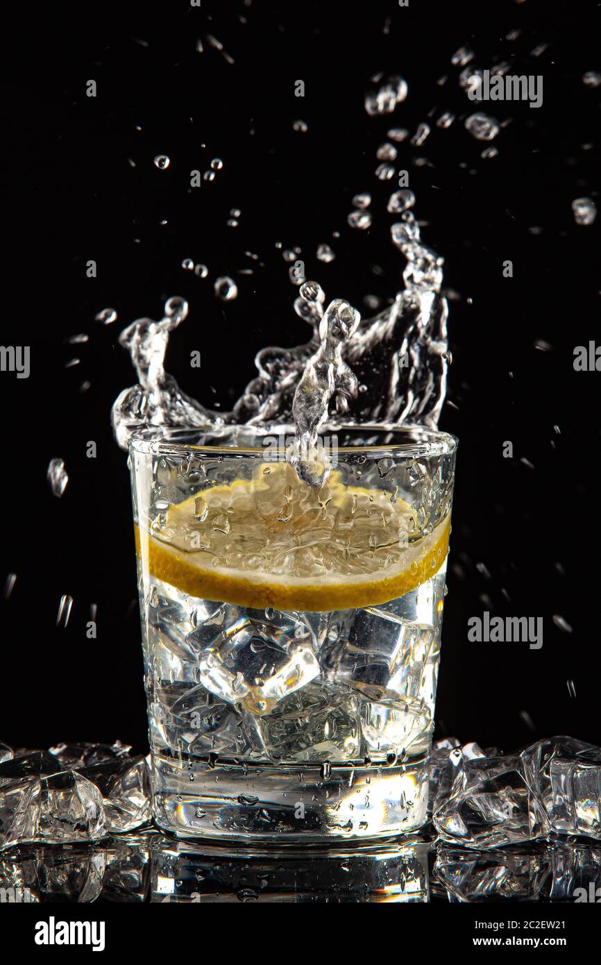 Glass Of Water, Ice And Lemon Stock Photo - Alamy
