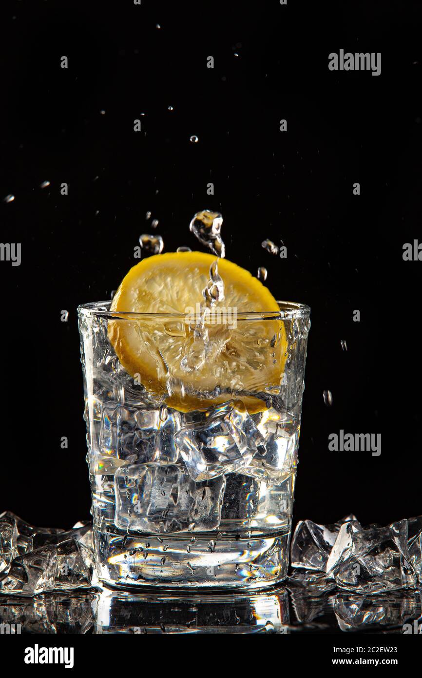 Glass Of Water, Ice And Lemon Stock Photo - Alamy