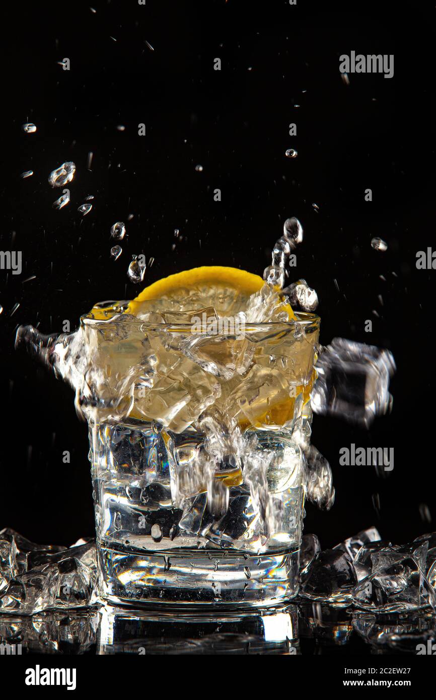 Glass Of Water, Ice And Lemon Stock Photo - Alamy