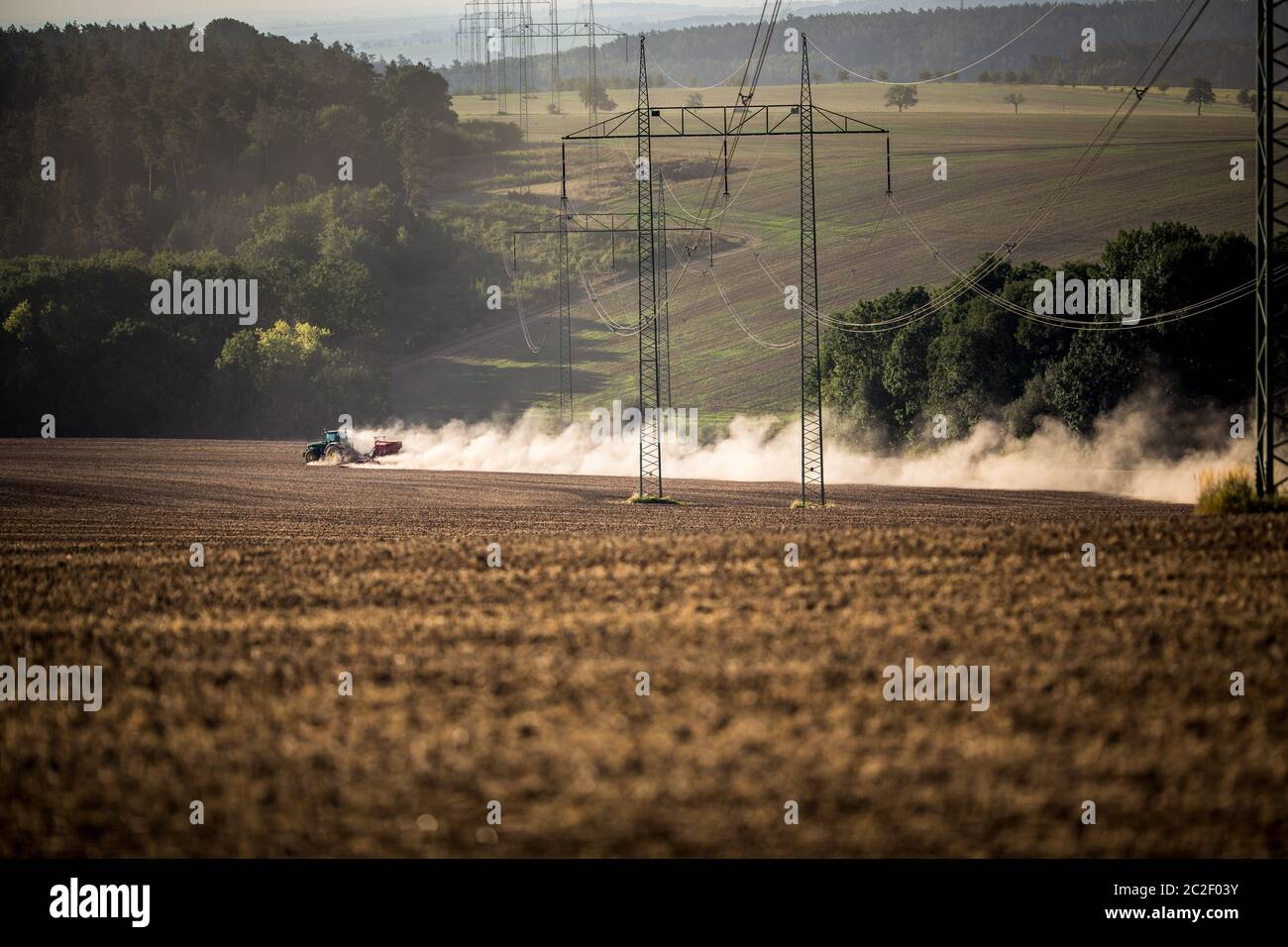 Tractor plowing a dry farm field Stock Photo - Alamy