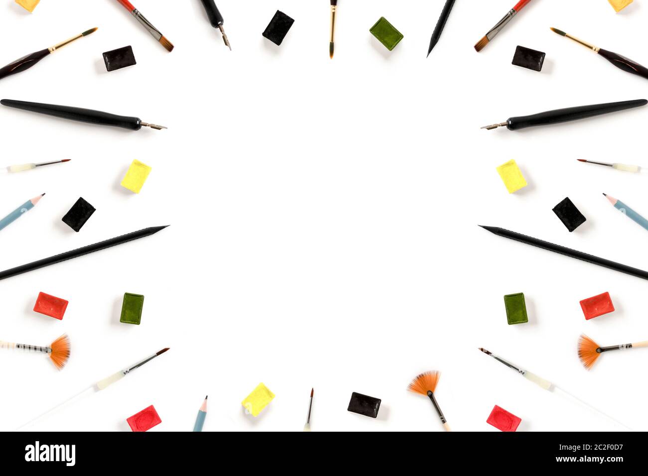 Frame made of paint brushes and watercolor on a white background ...