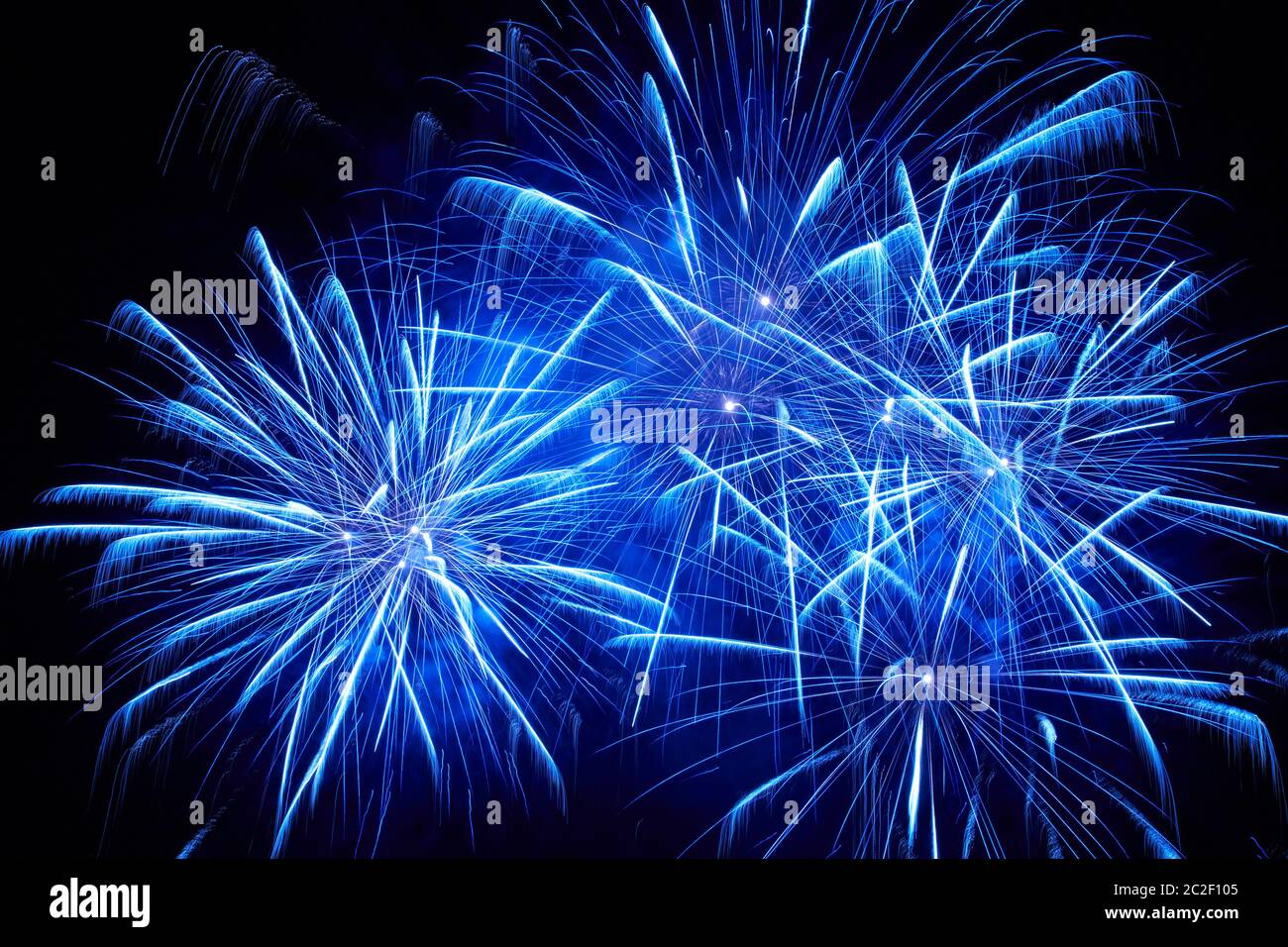 Blue colorful fireworks on the black sky background Stock Photo - Alamy