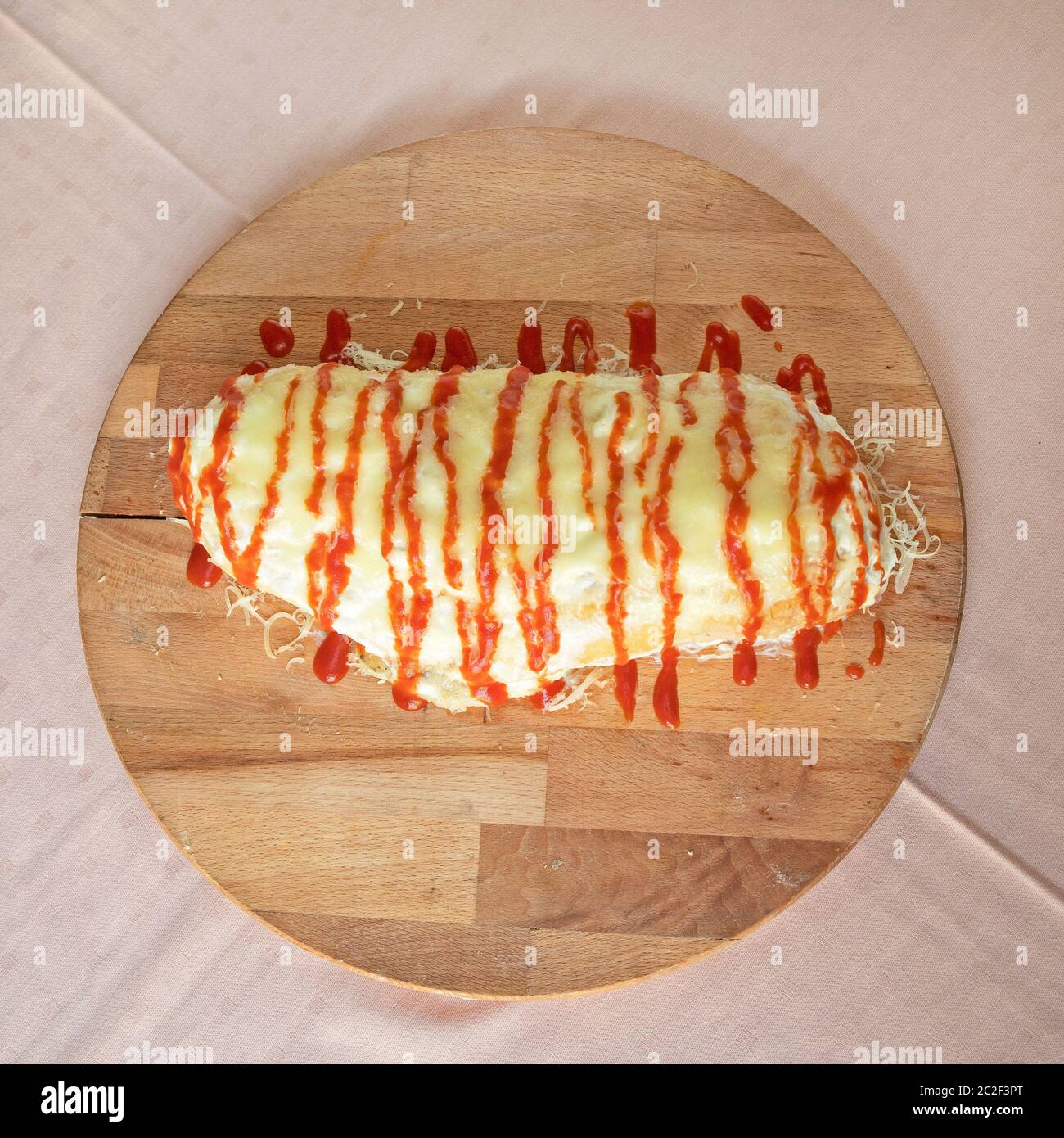 Folded Calzone Italian Cuisine at Wooden Tray Stock Photo - Alamy