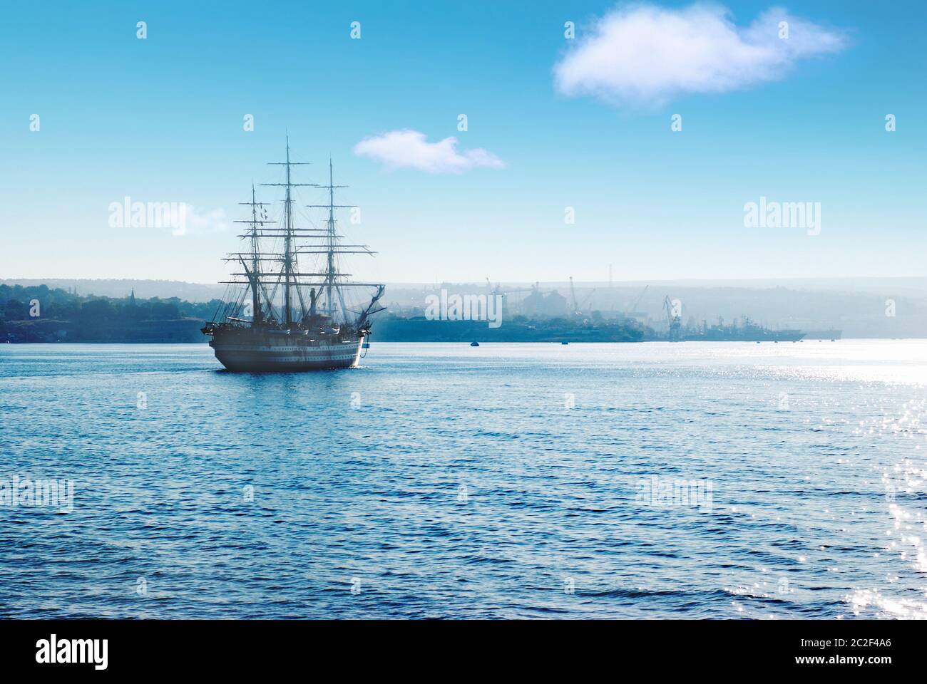 Beautiful sailing vessel in the sea comes into bay Stock Photo - Alamy