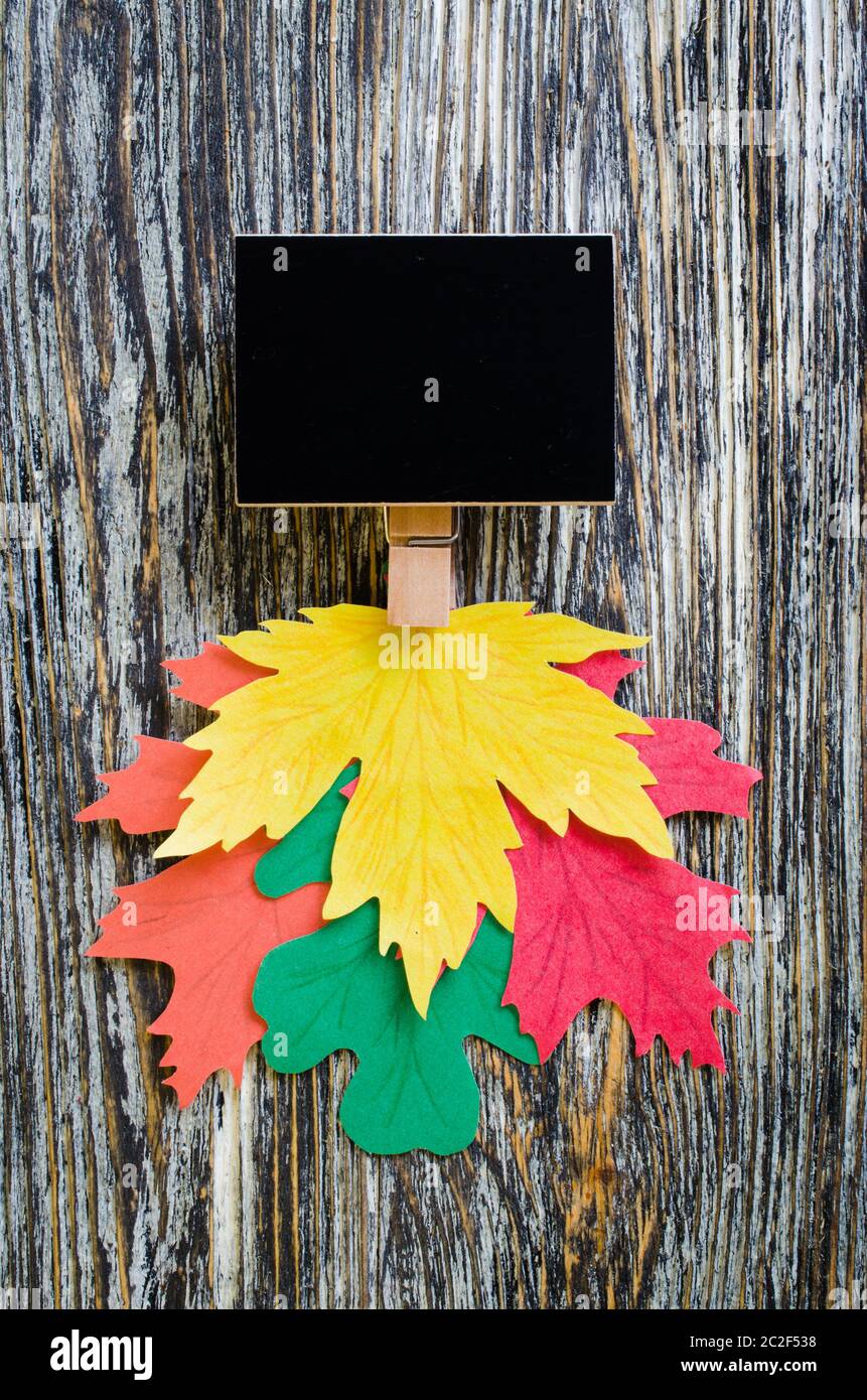 Autumn background: chalk board with colorful paper leaves on vintage ...
