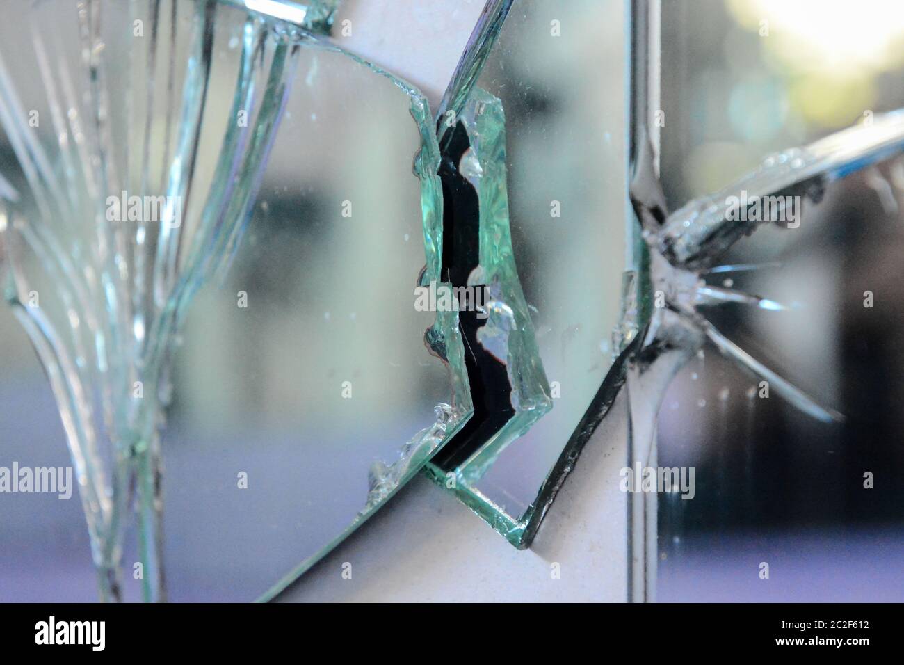 Photo of Broken mirror shattered in many pieces Stock Photo - Alamy