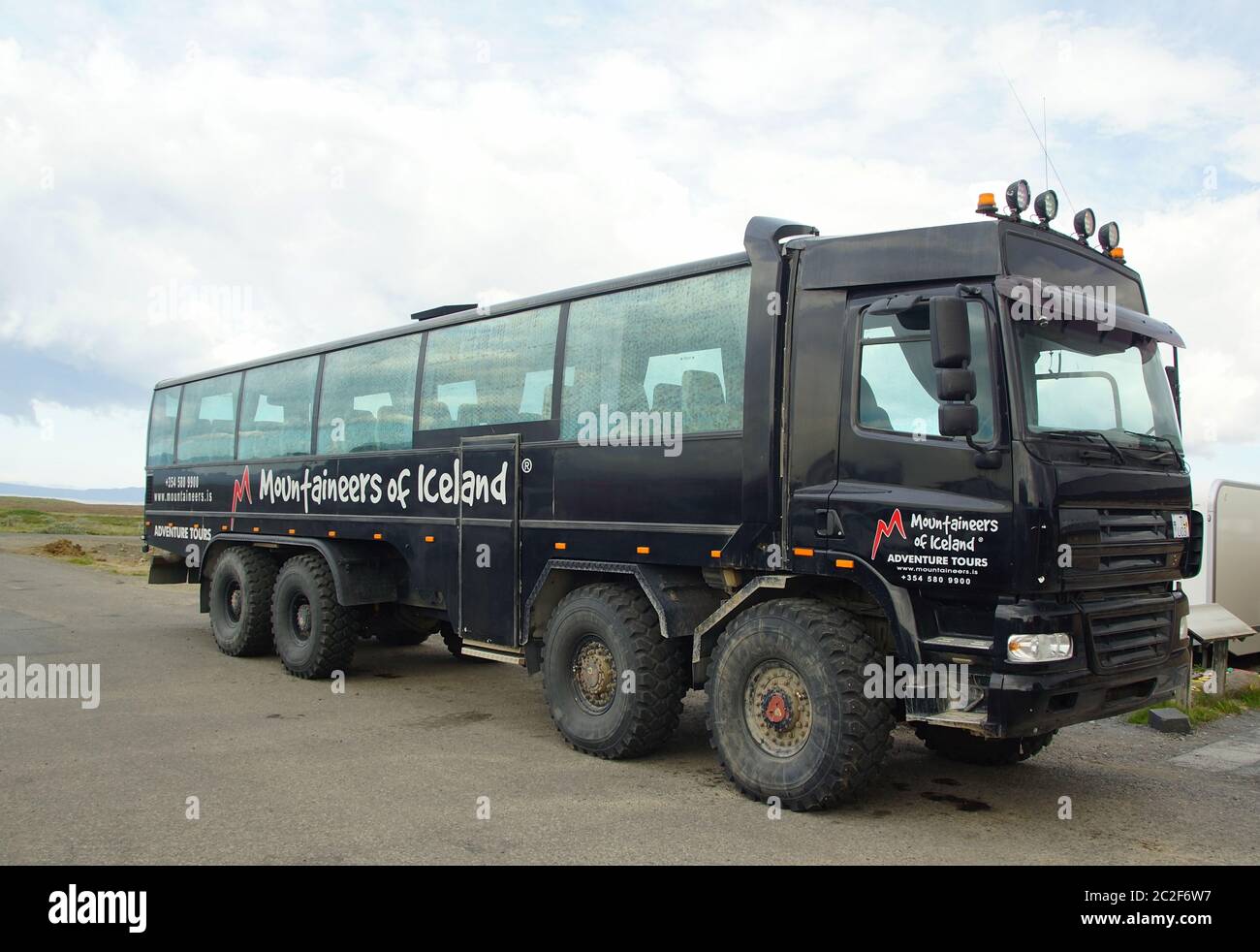 A tourist bus all-terrain vehicle on a car site Stock Photo - Alamy