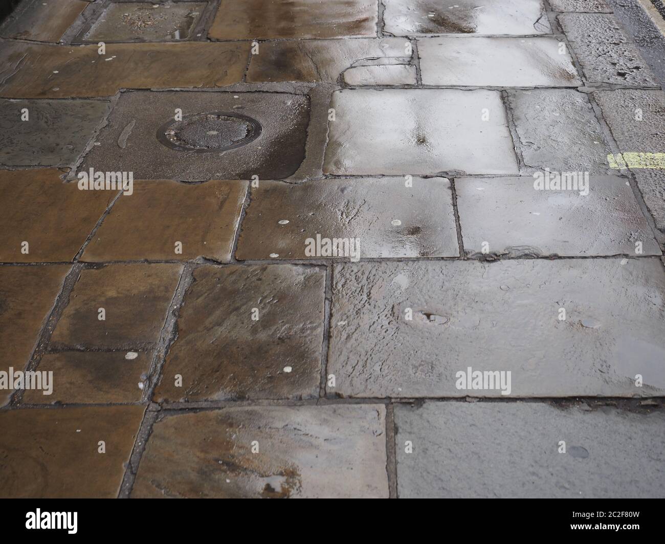 wet pavement useful as a background with copy space Stock Photo - Alamy