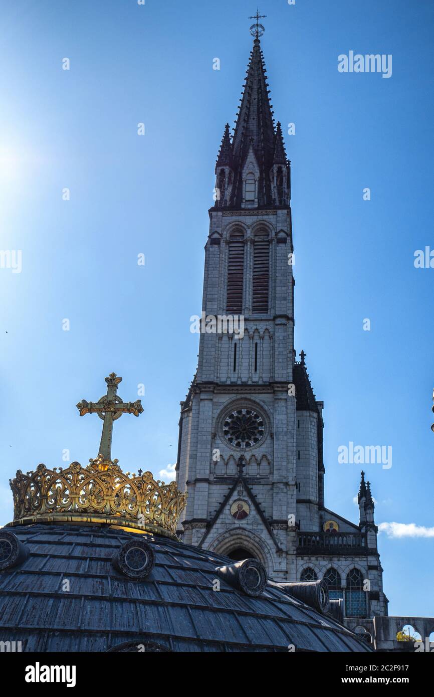 The gilded crown ad cross in Lourdes city Stock Photo - Alamy