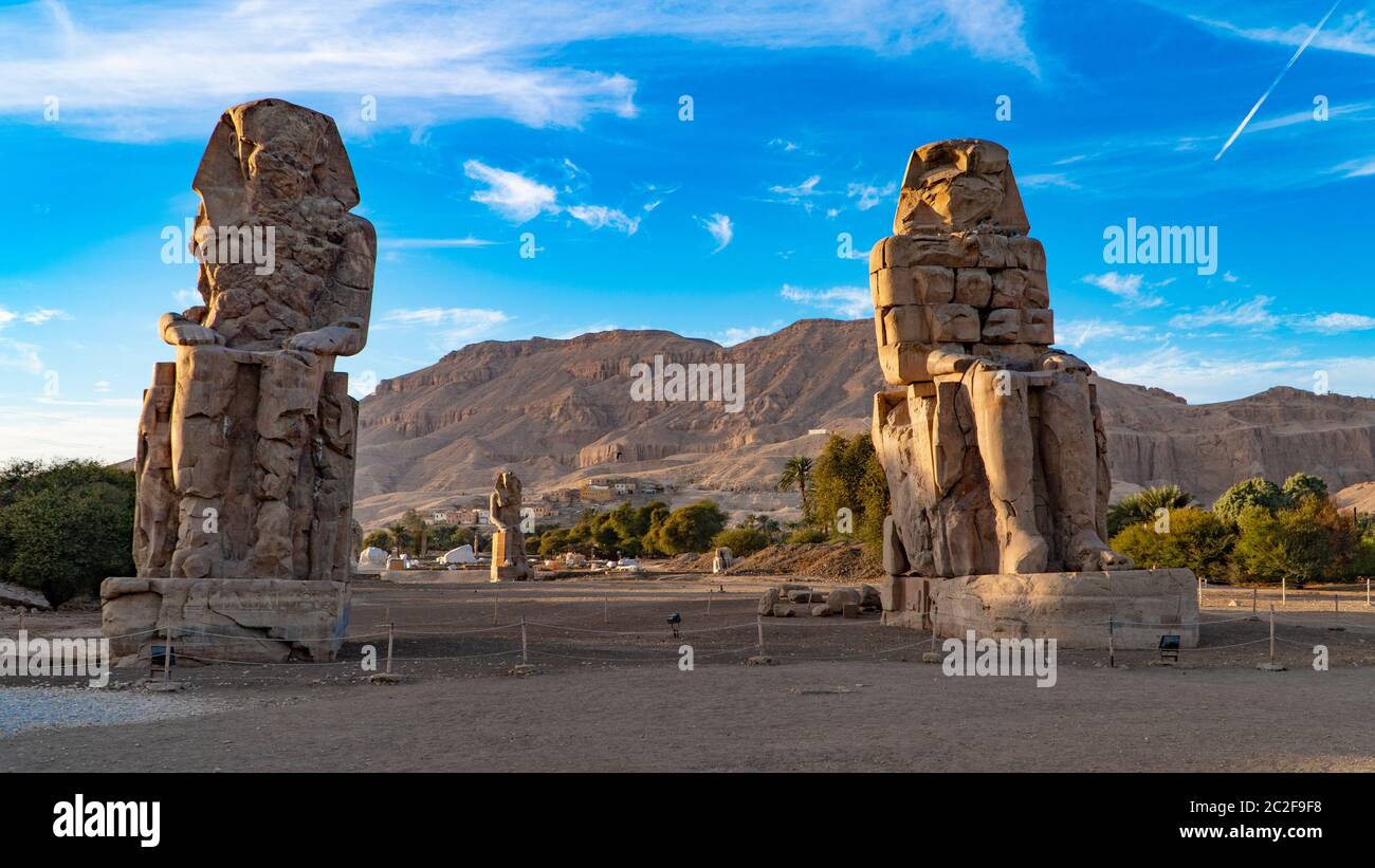 The Colossi of Memnon, two stone massive statues of the Pharaoh ...