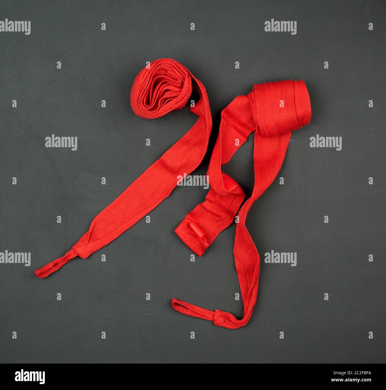pair of textile red bandages for winding hands to athletes before ...