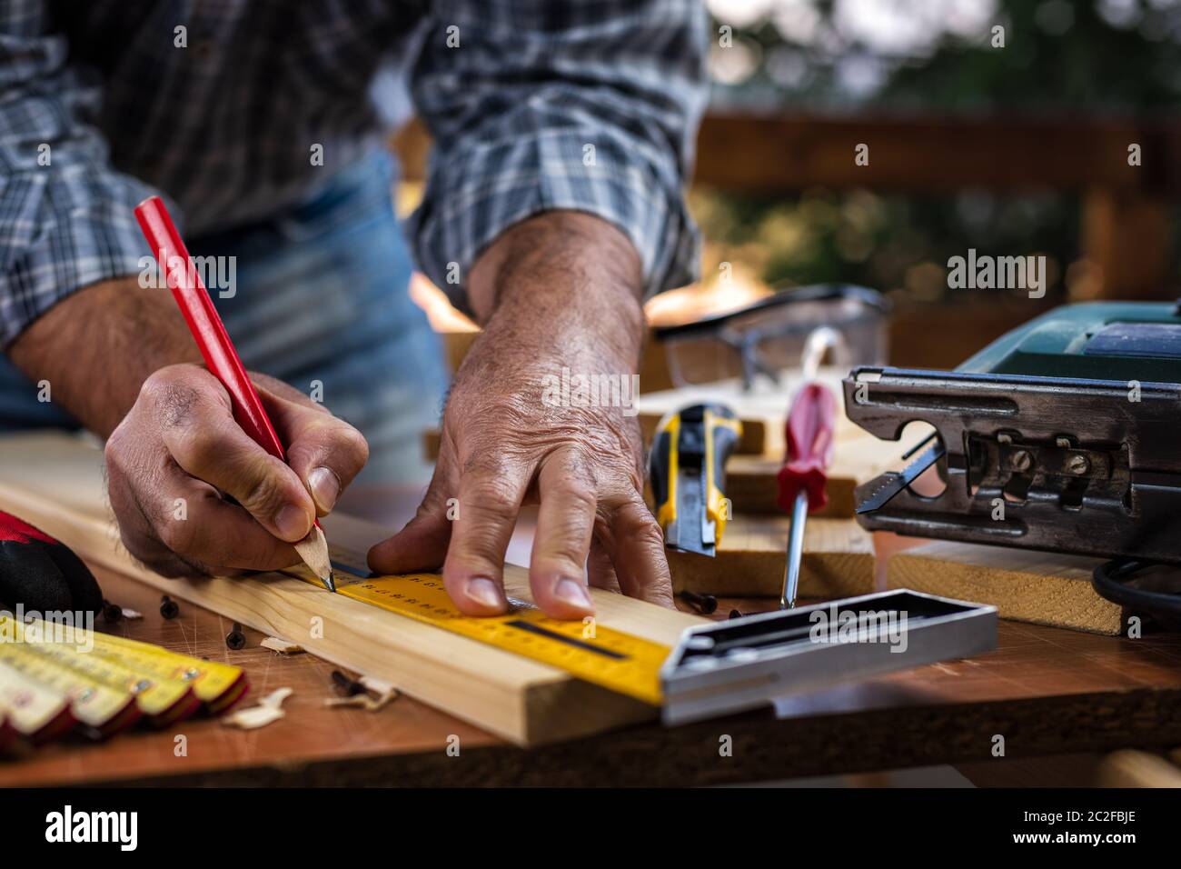 Worker mark pencil on ruler hi-res stock photography and images - Alamy
