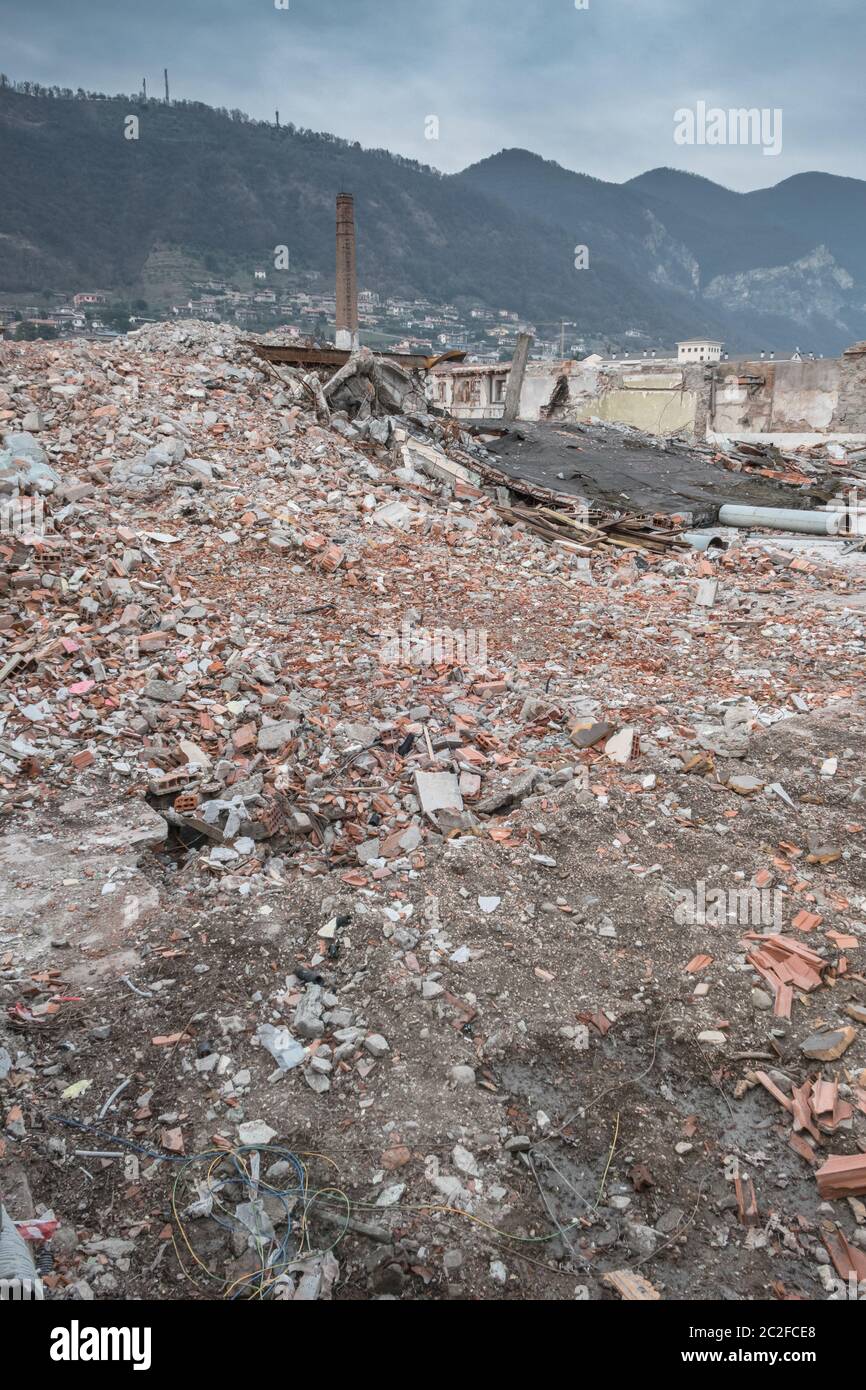 Demolition of buildings in urban environments. On background green ...