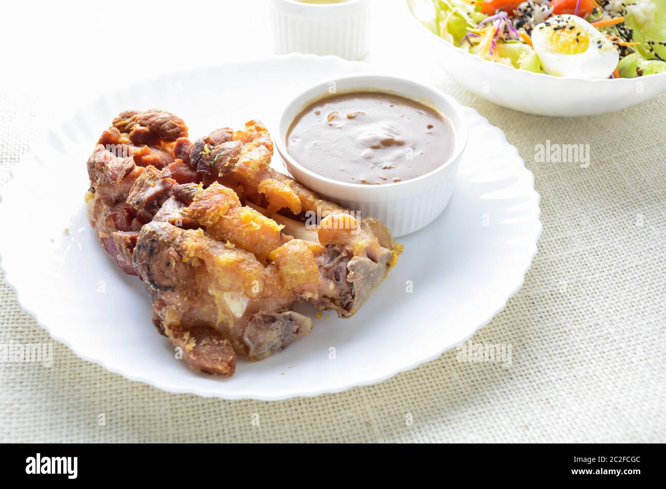 Deep fried pork knuckle with mushroom gravy source, fresh vegetable and ...
