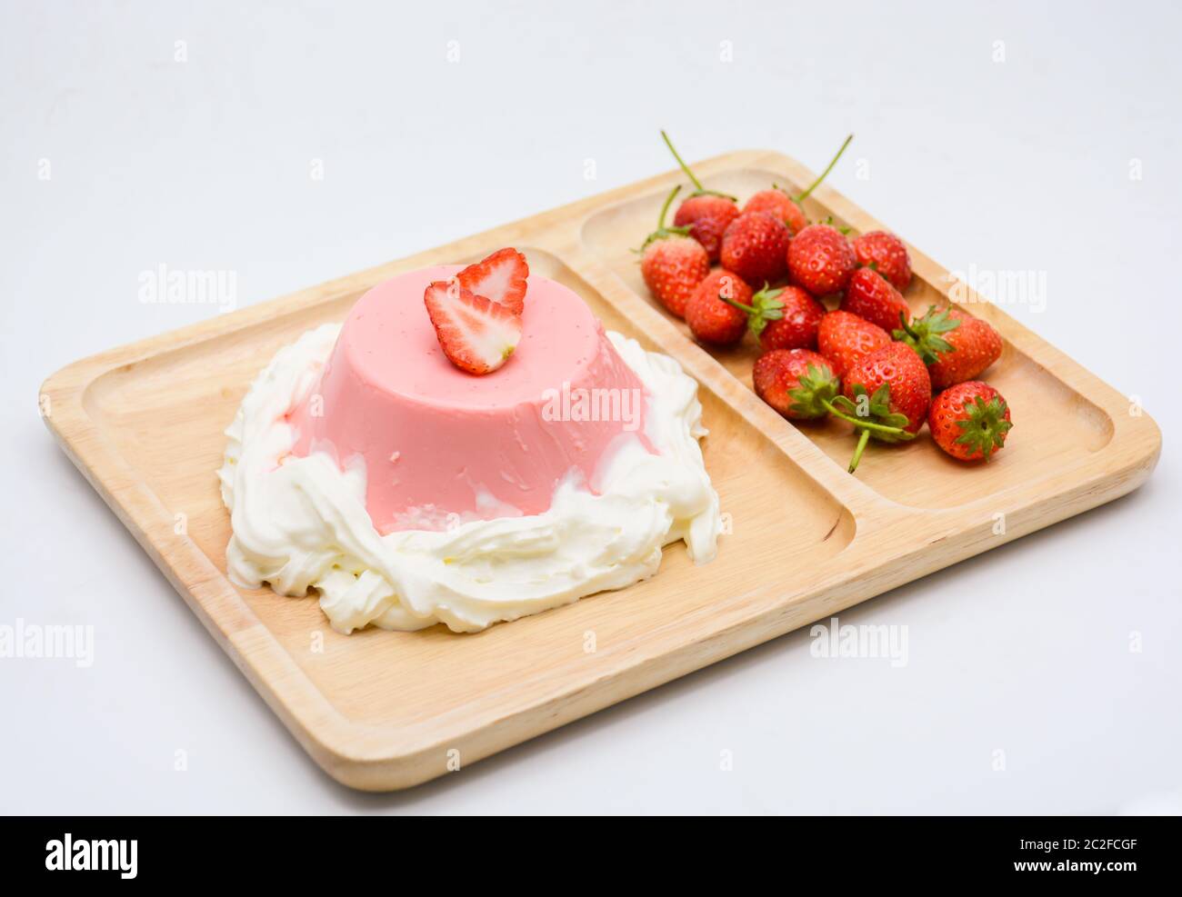 Italian dessert Pana Cotta with strawberries Stock Photo - Alamy