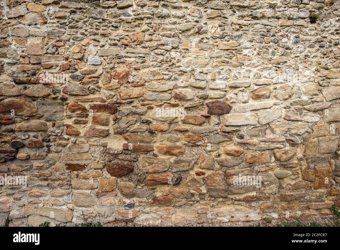 Medieval stone wall, old rock background, texture Stock Photo - Alamy