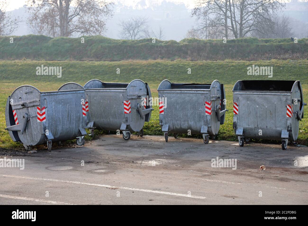 Four Big Metal Containers for Communal Garbage Waste Stock Photo - Alamy