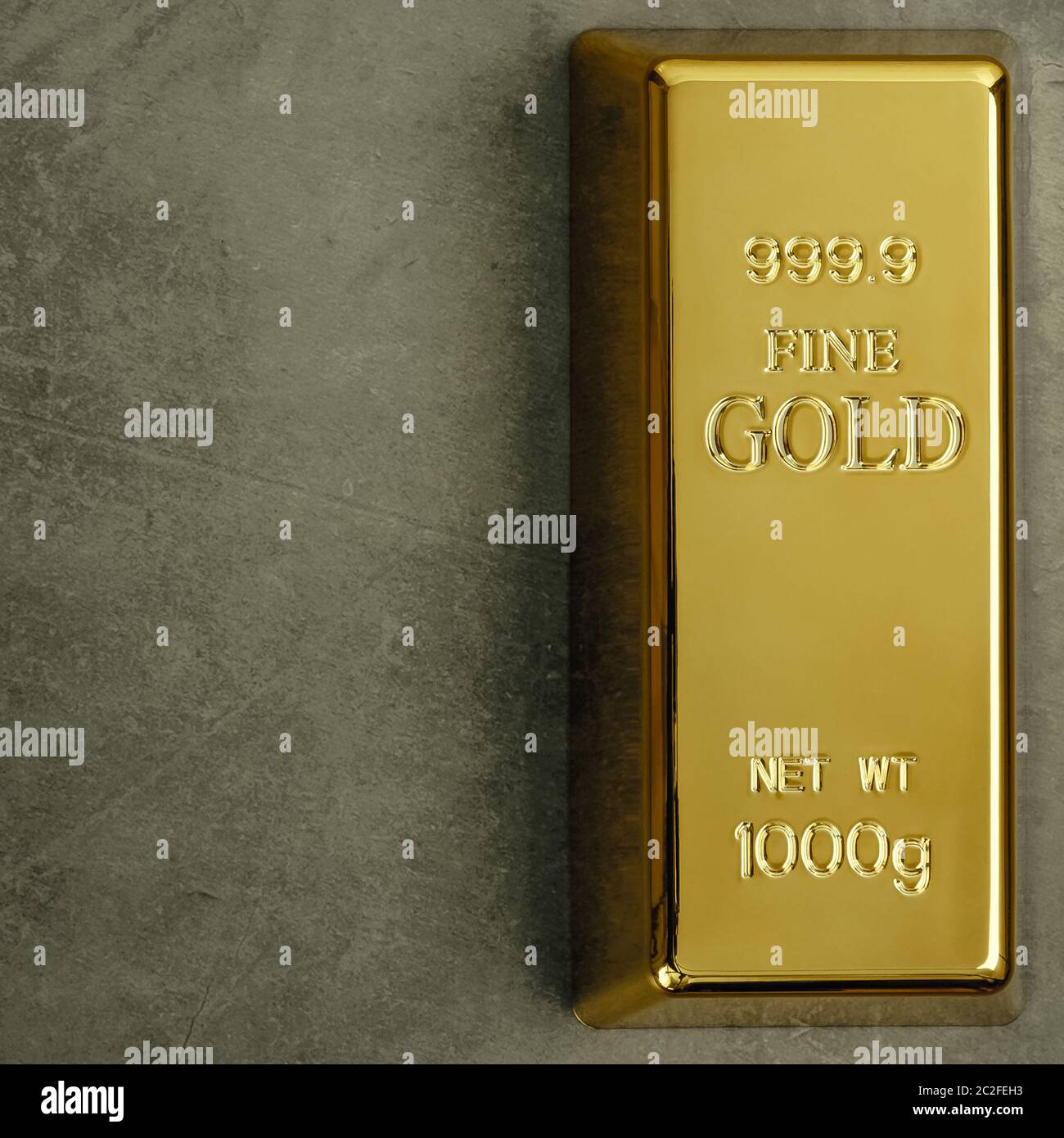 Ingot of pure gold metal bullion on a gray textured background Stock ...