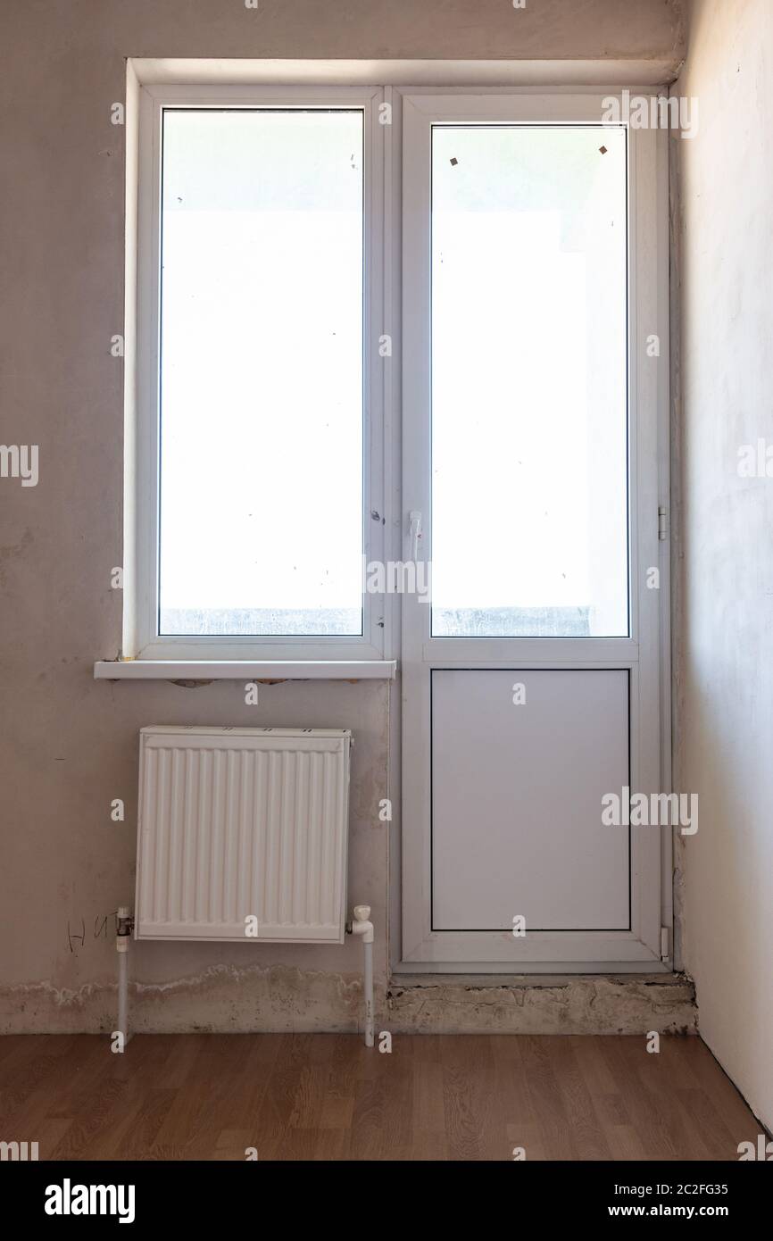 Exit to the balcony in the interior of an unrepaired room Stock Photo ...