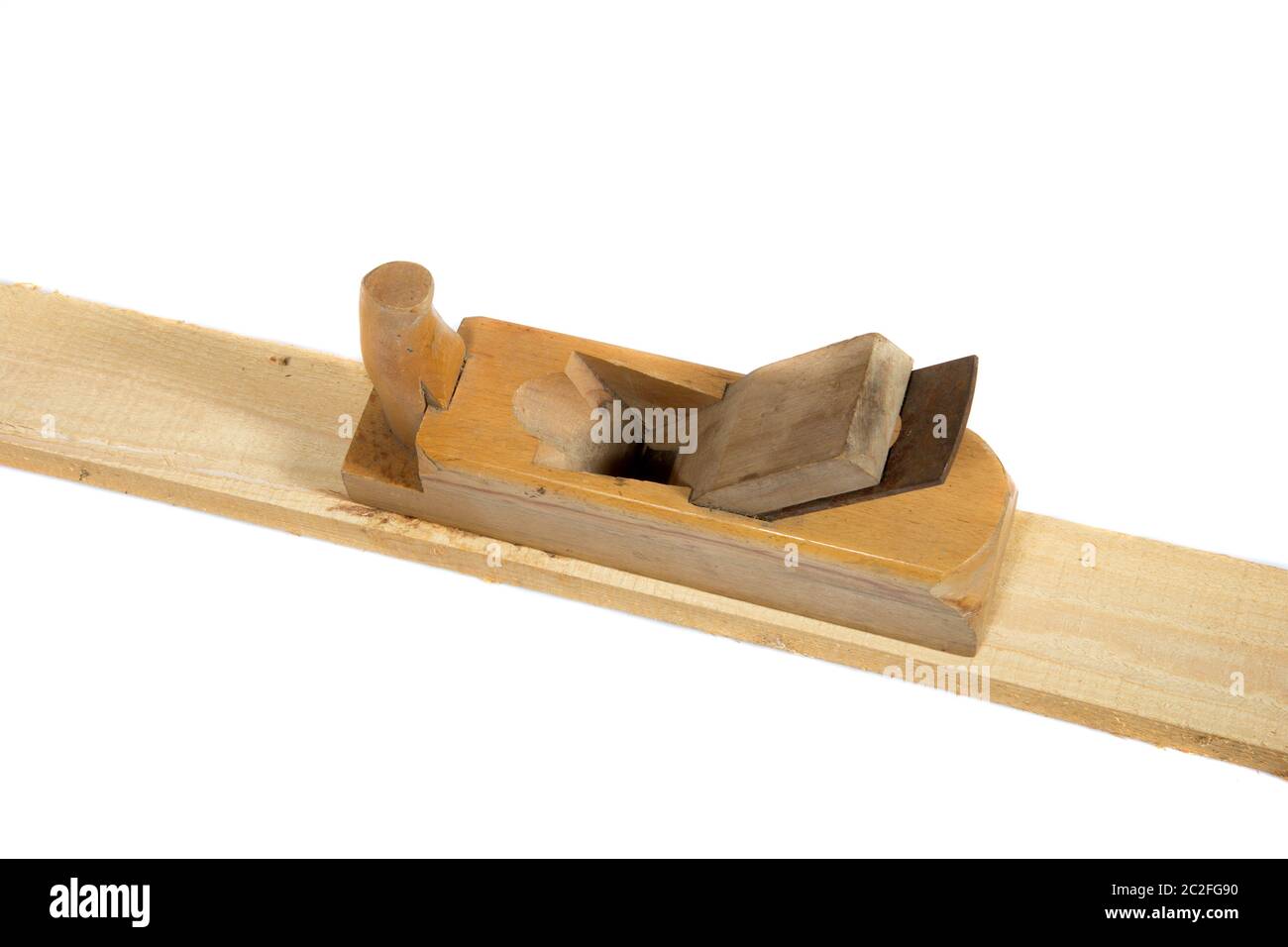 Old wooden hand planer or Carpenter Tool on wood plank isolated white ...
