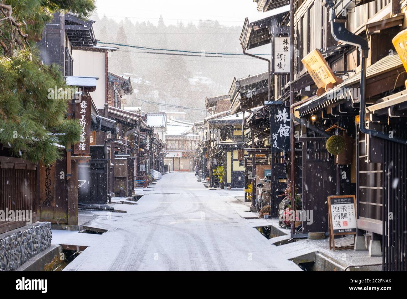 Takayama old town with snow falling in Gifu, Japan Stock Photo - Alamy